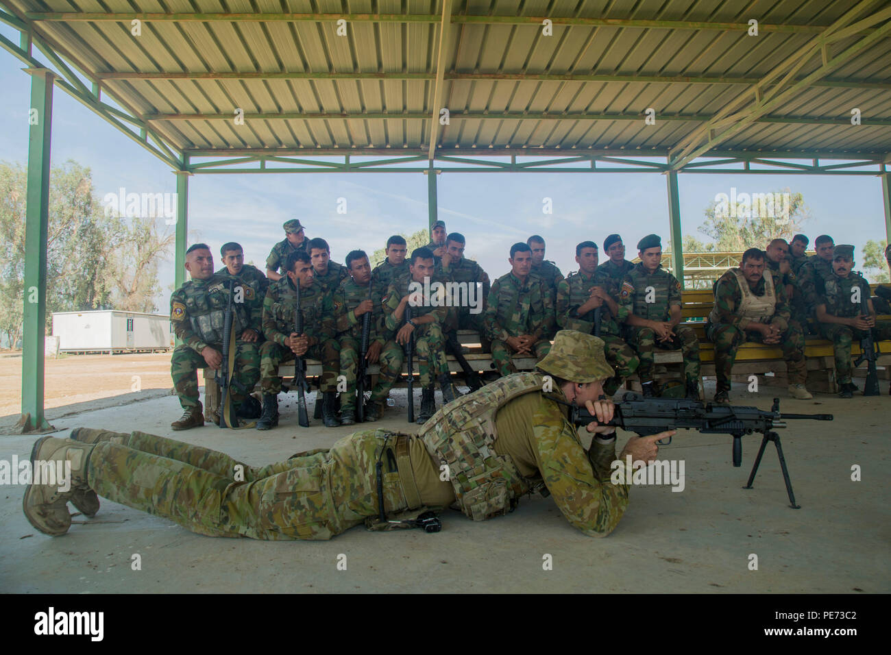 An Australian soldier assigned to Task Group Taji demonstrates how to ...