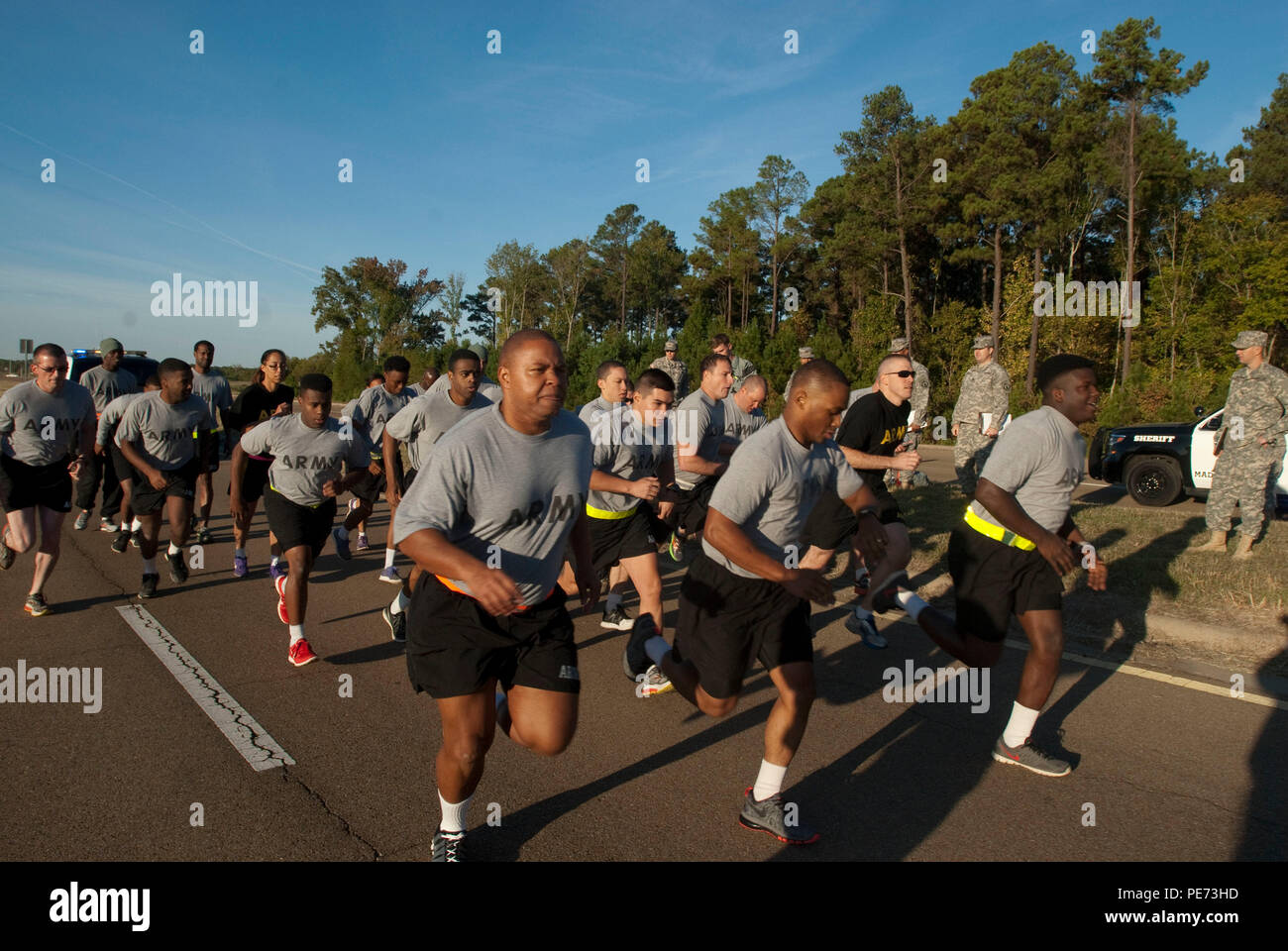Spc. Neikolus Johnson (center), a motor transport operator with the ...