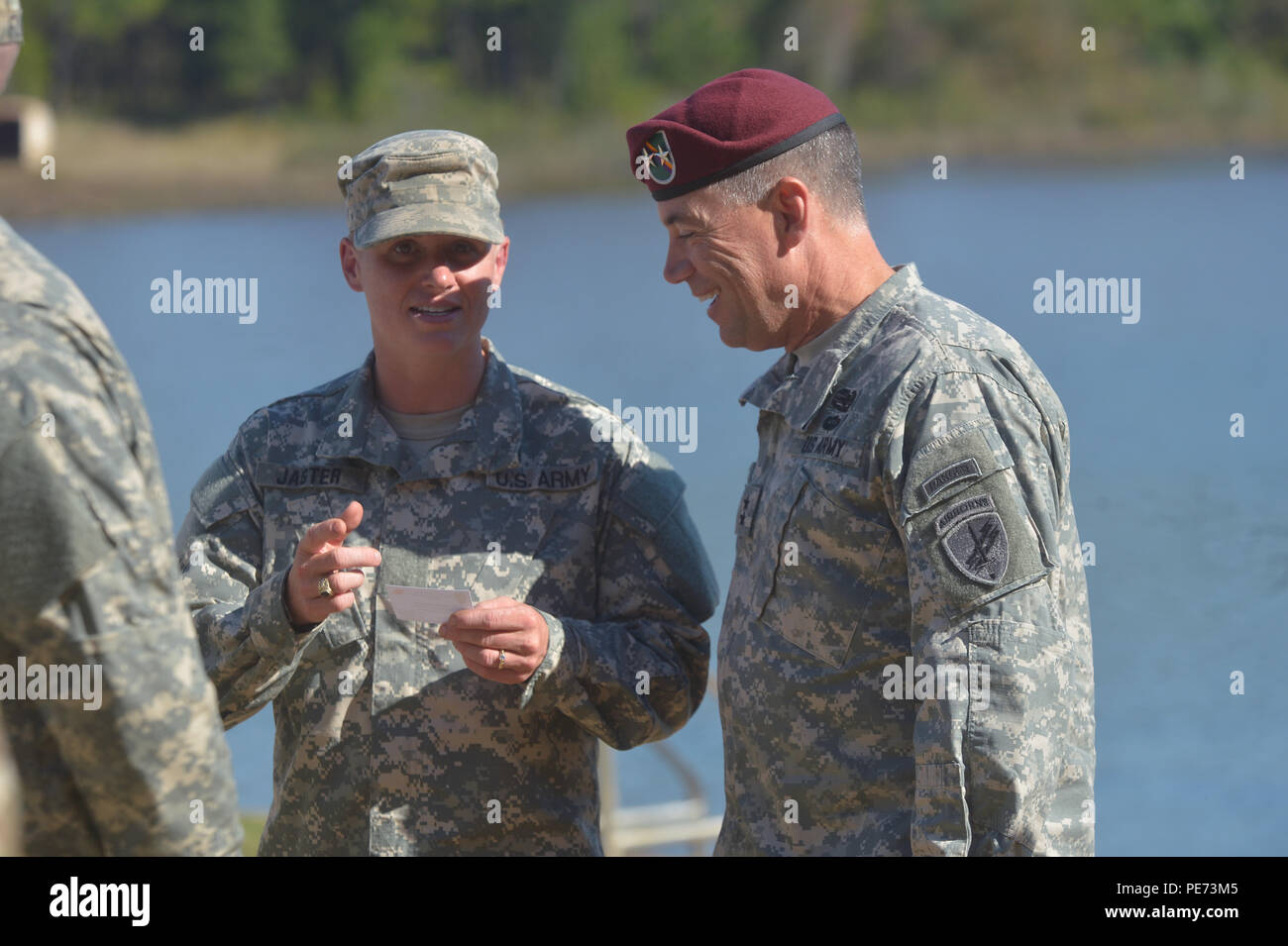 U.S. Army Maj. Lisa Jaster, left, talks with Maj. Gen. Daniel R ...