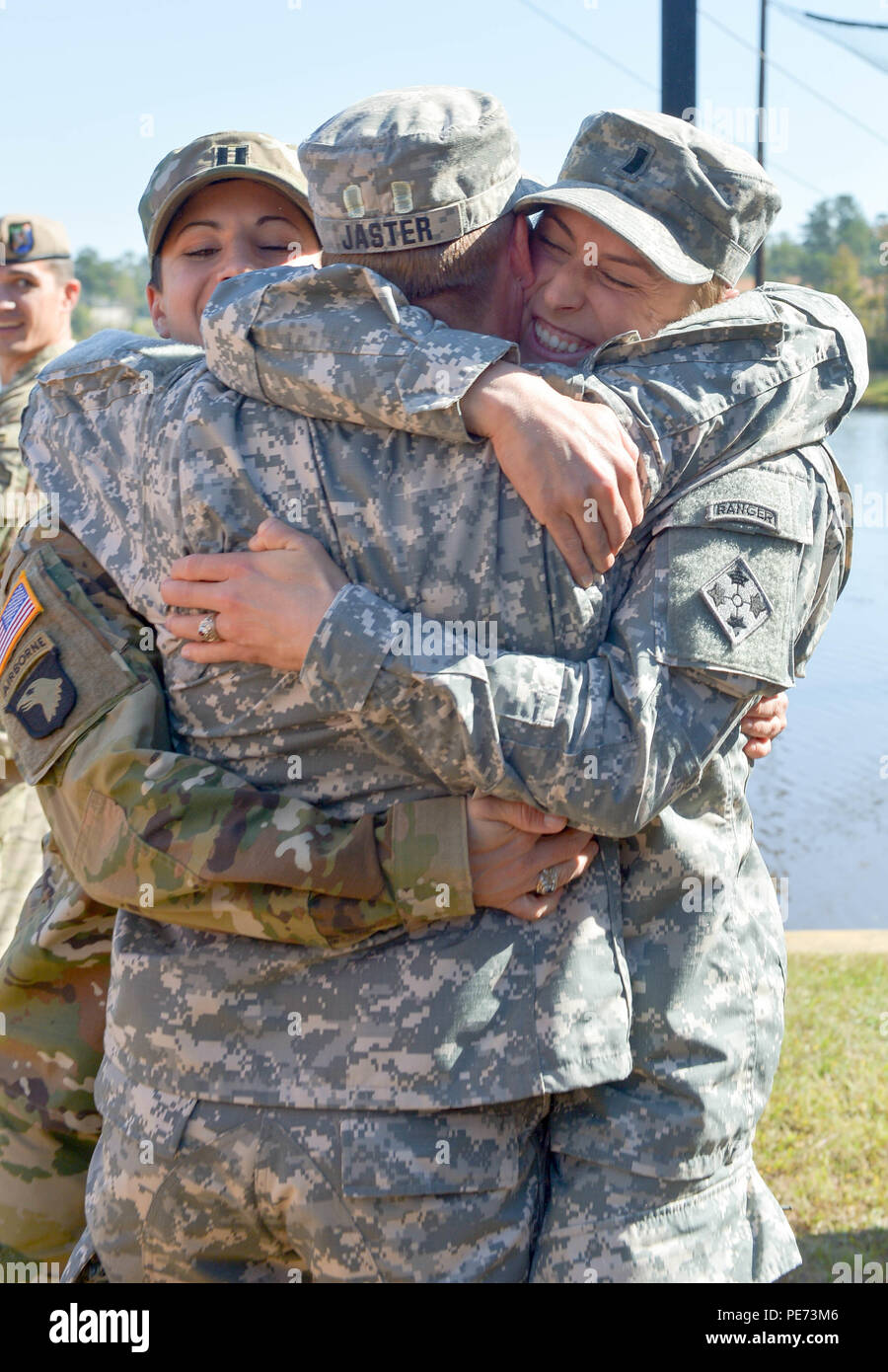 U.S. Army Maj. Lisa Jaster is congratulated by Capt. Kristen Griest ...