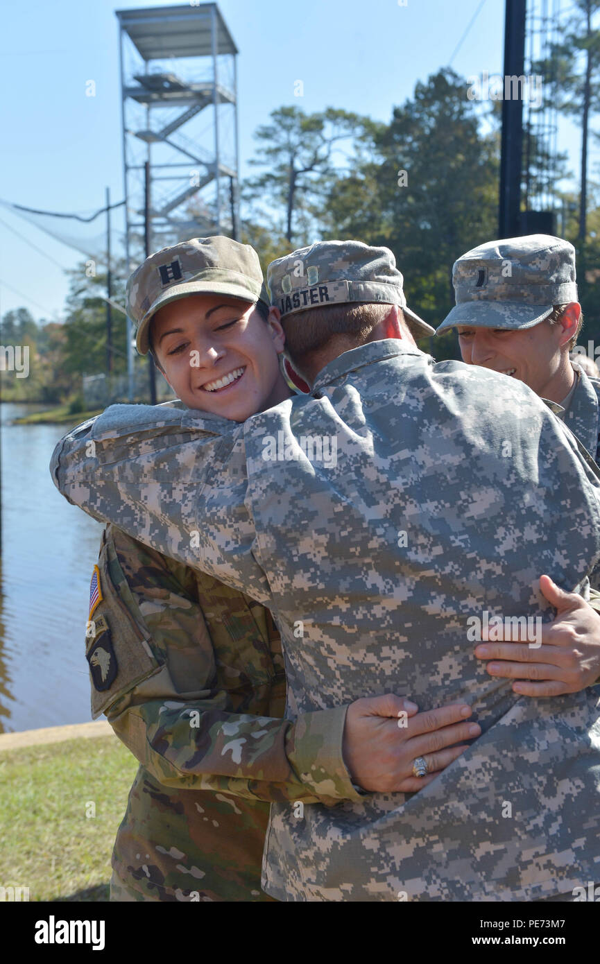 U.S. Army Maj. Lisa Jaster is congratulated by Capt. Kristen Griest ...
