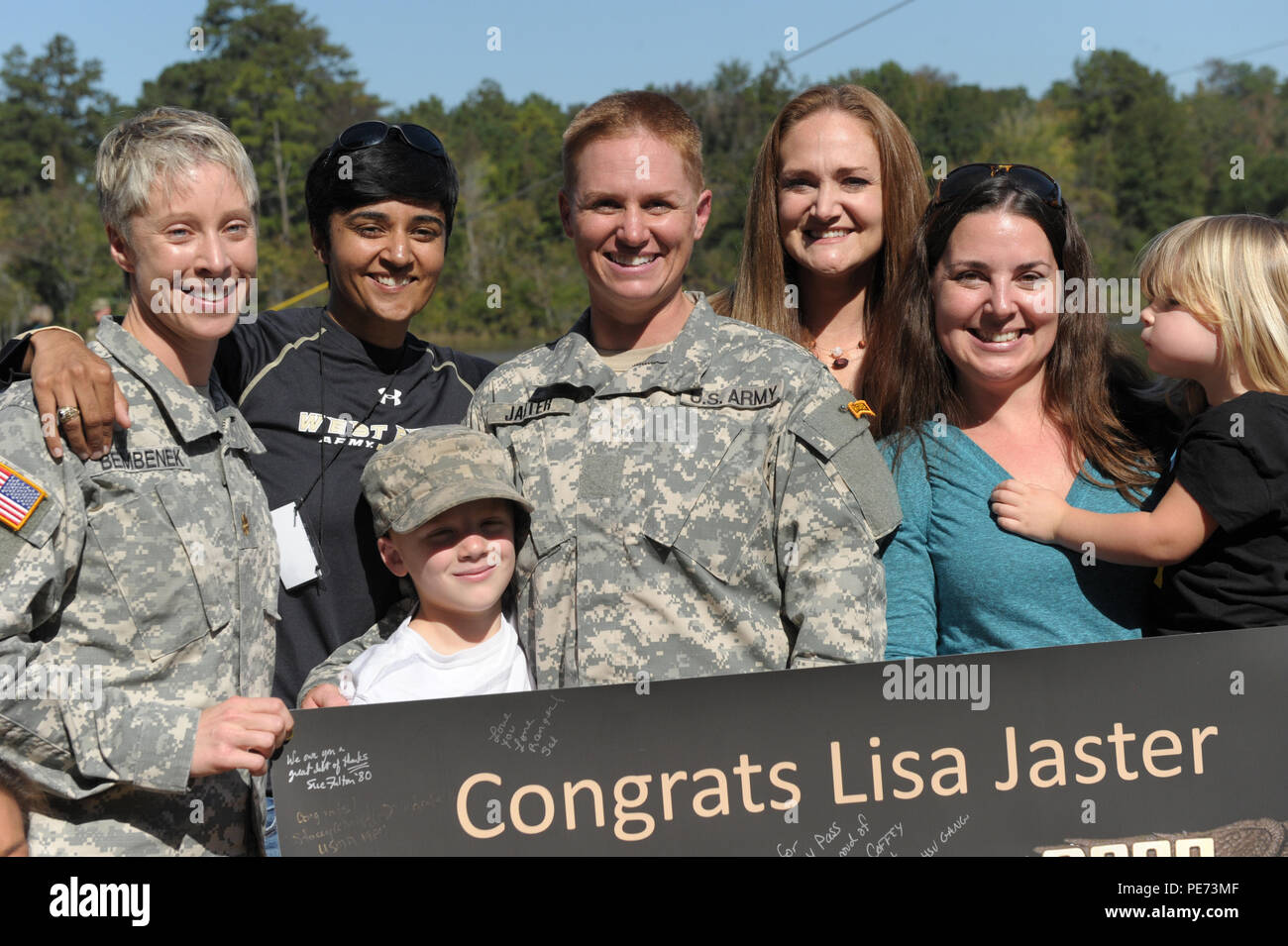 U.S. Army Maj. Lisa Jaster, center, celebrates with friends and family ...