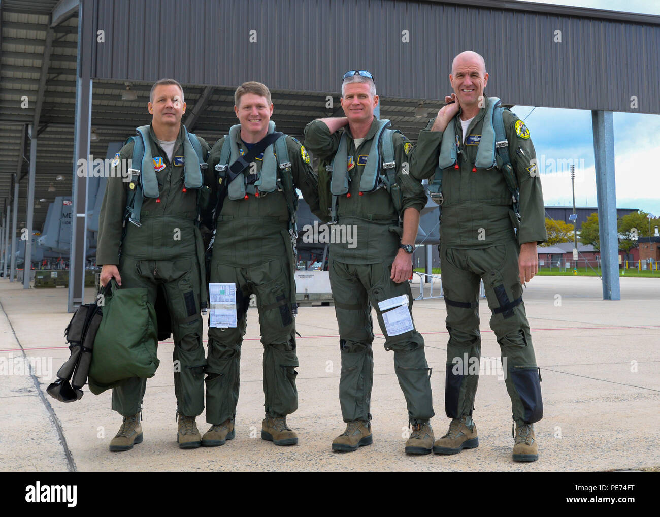 Brig. Gen. Scott Kelly, 175th Wing commander, poses with (left to right ...