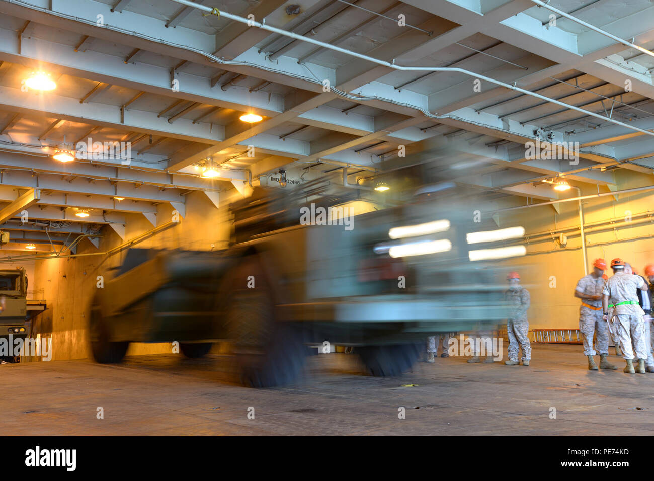 U.S. Marines unload vehicles and equipment from the U.S. Naval Ship Sgt ...