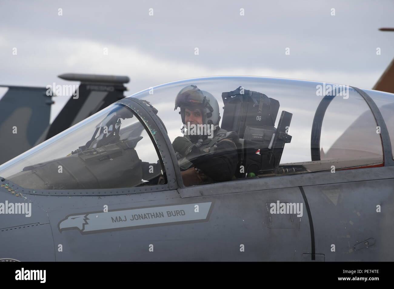 U.S. Air Force Lt. Col. Christopher Ridlon, 194th Fighter Squadron pilot, gives a thumbs up ...