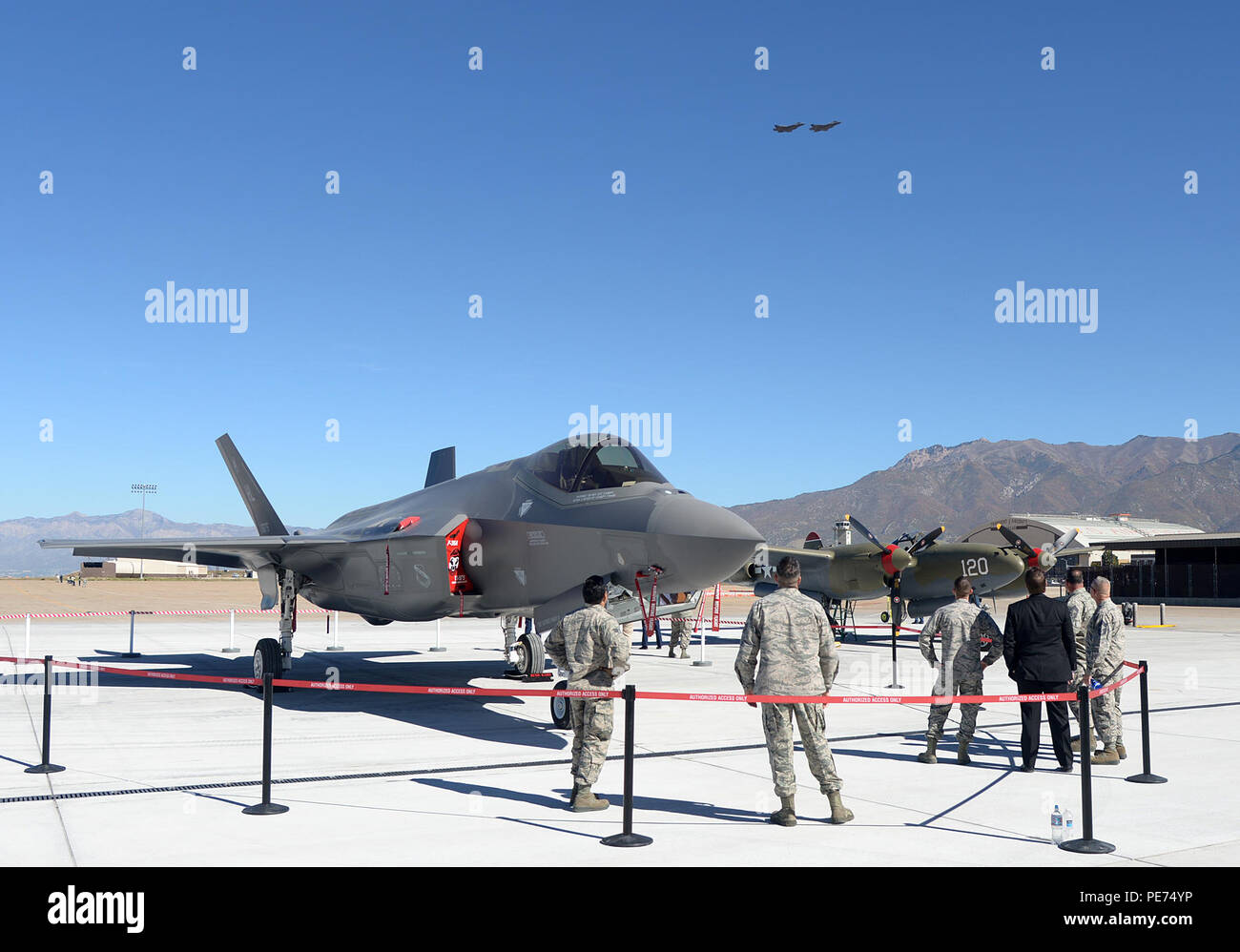 Two F-35A Lightning II aircraft fly in formation over a P-38 Lightning ...