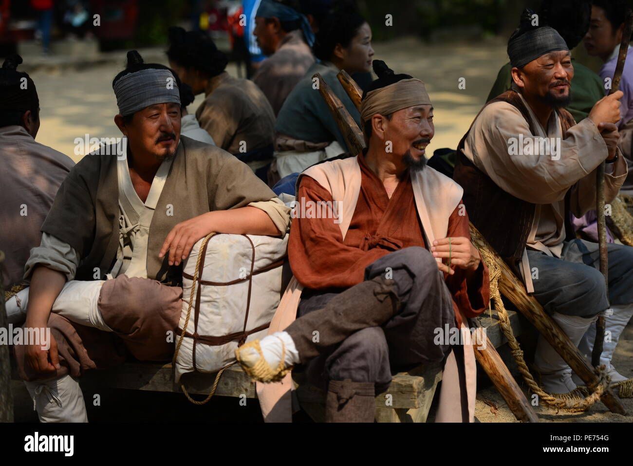 Actors, dressed in the traditional garb of peasants from the Joseon ...
