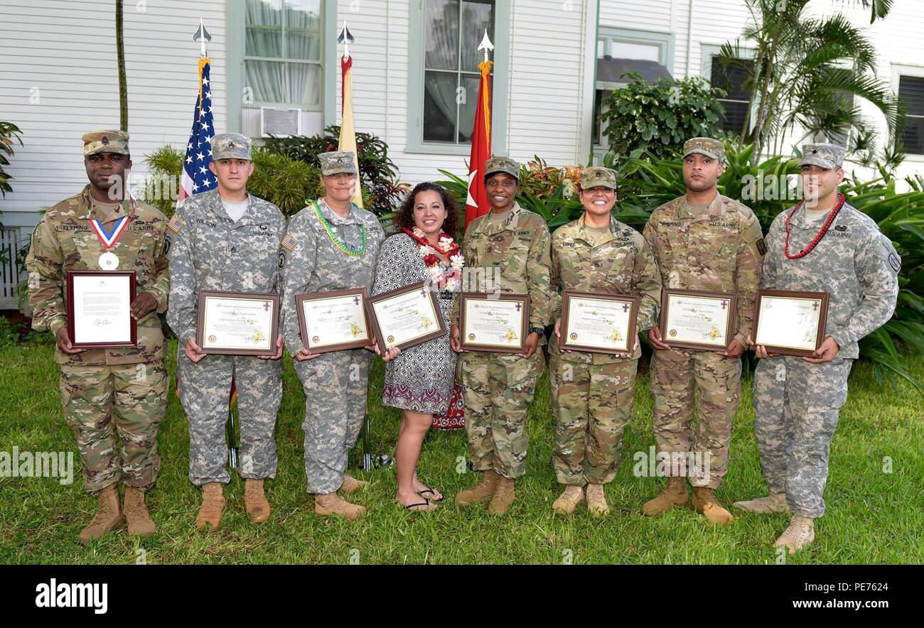Volunteers in the 8th Theater Sustainment Command take a photo after ...