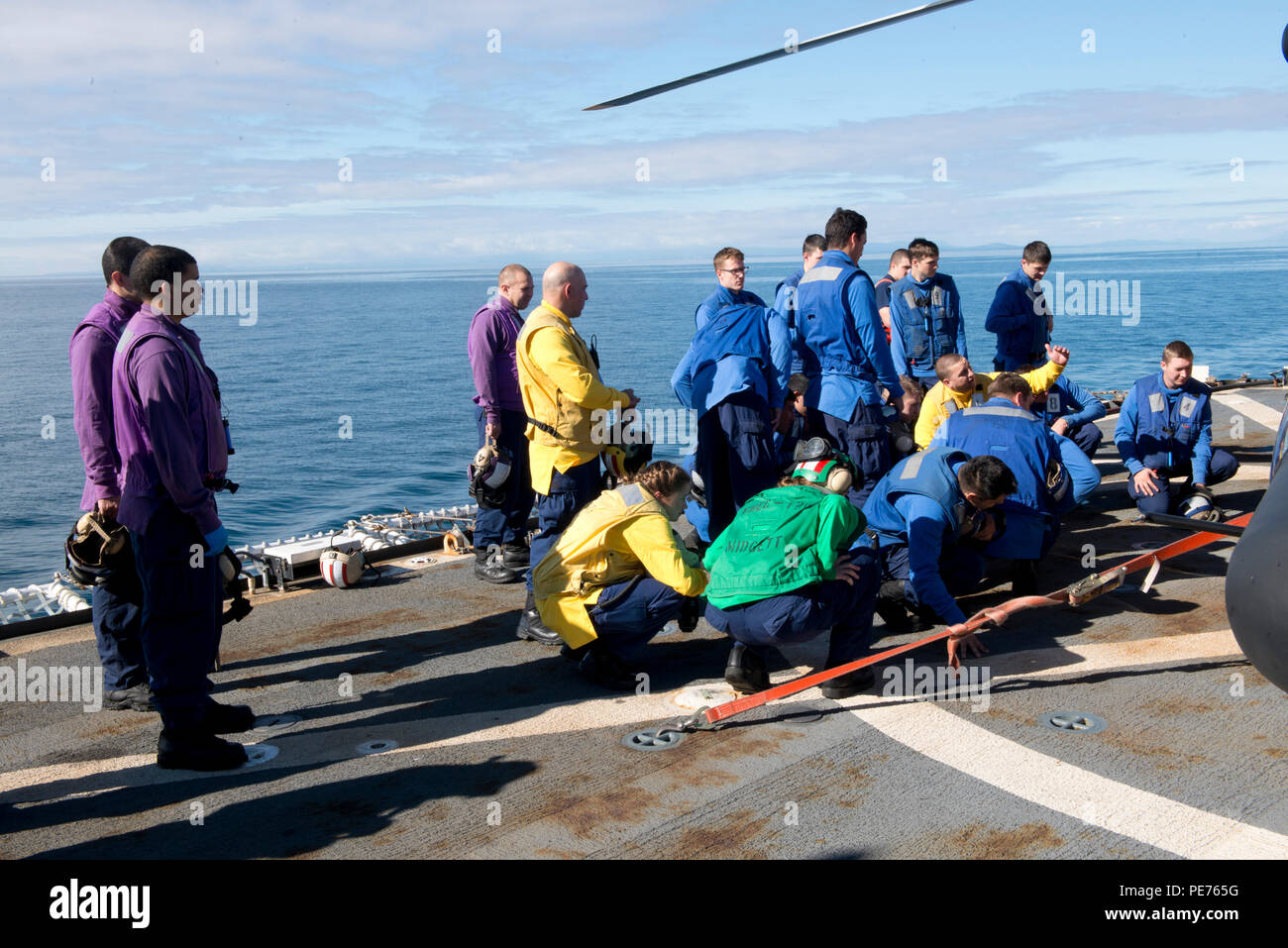 Chief Warrant Officer Jason Perry (yellow right) gives instruction ...