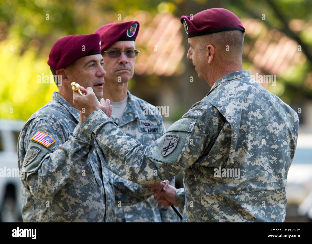 Command Sgt. Maj. Harry Bennett (right) passes the sword to Maj. Gen ...