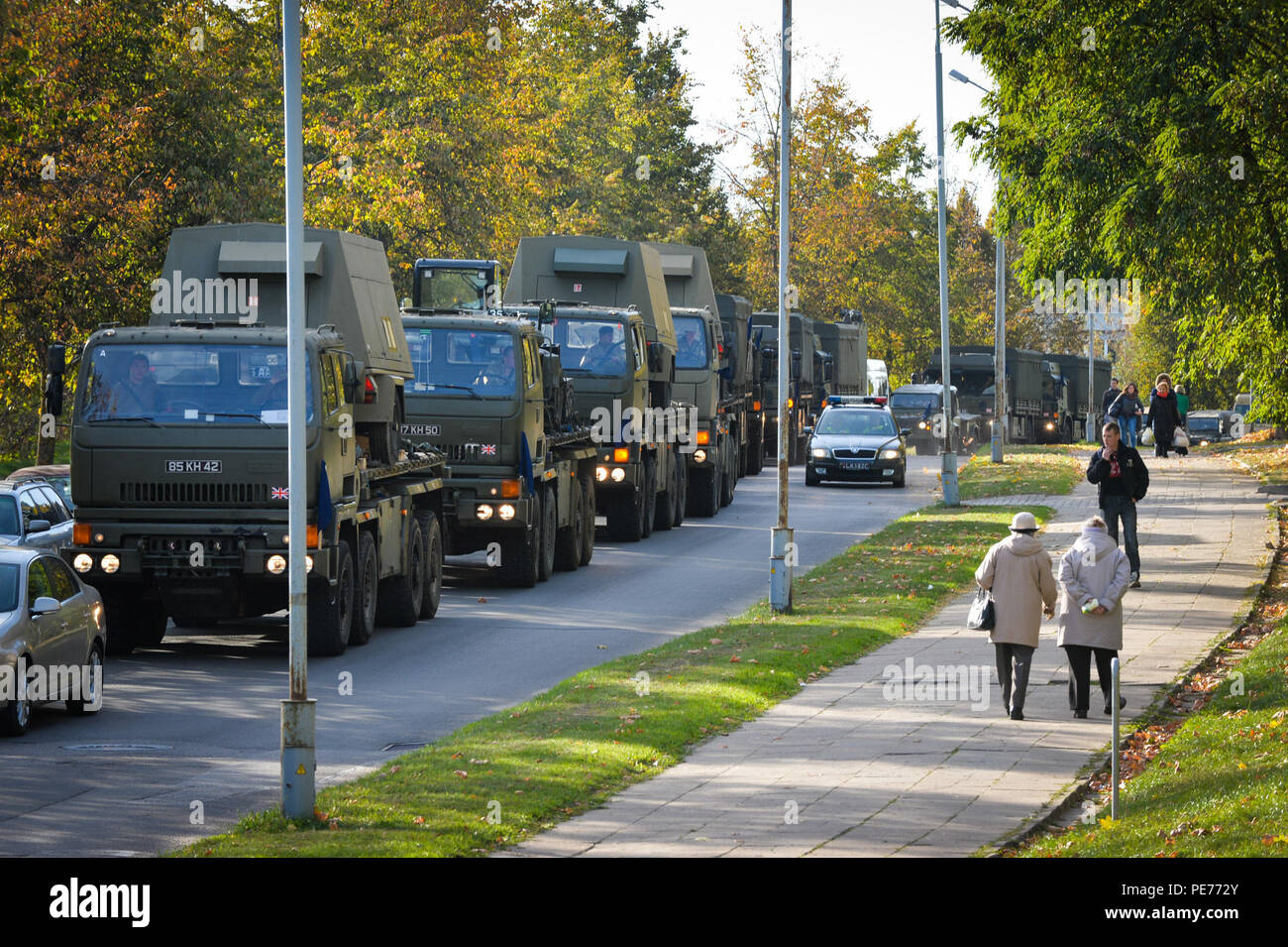 A convoy drives through the streets supported by Lithuanian military ...