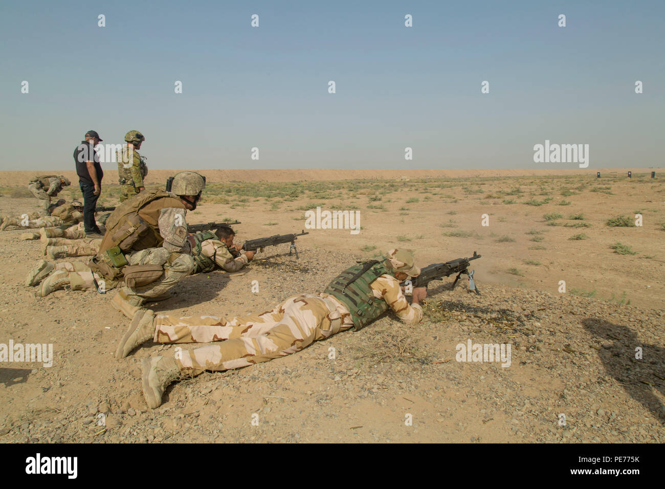 Iraqi soldiers assigned to the 71st Iraqi Army Brigade fire their ...
