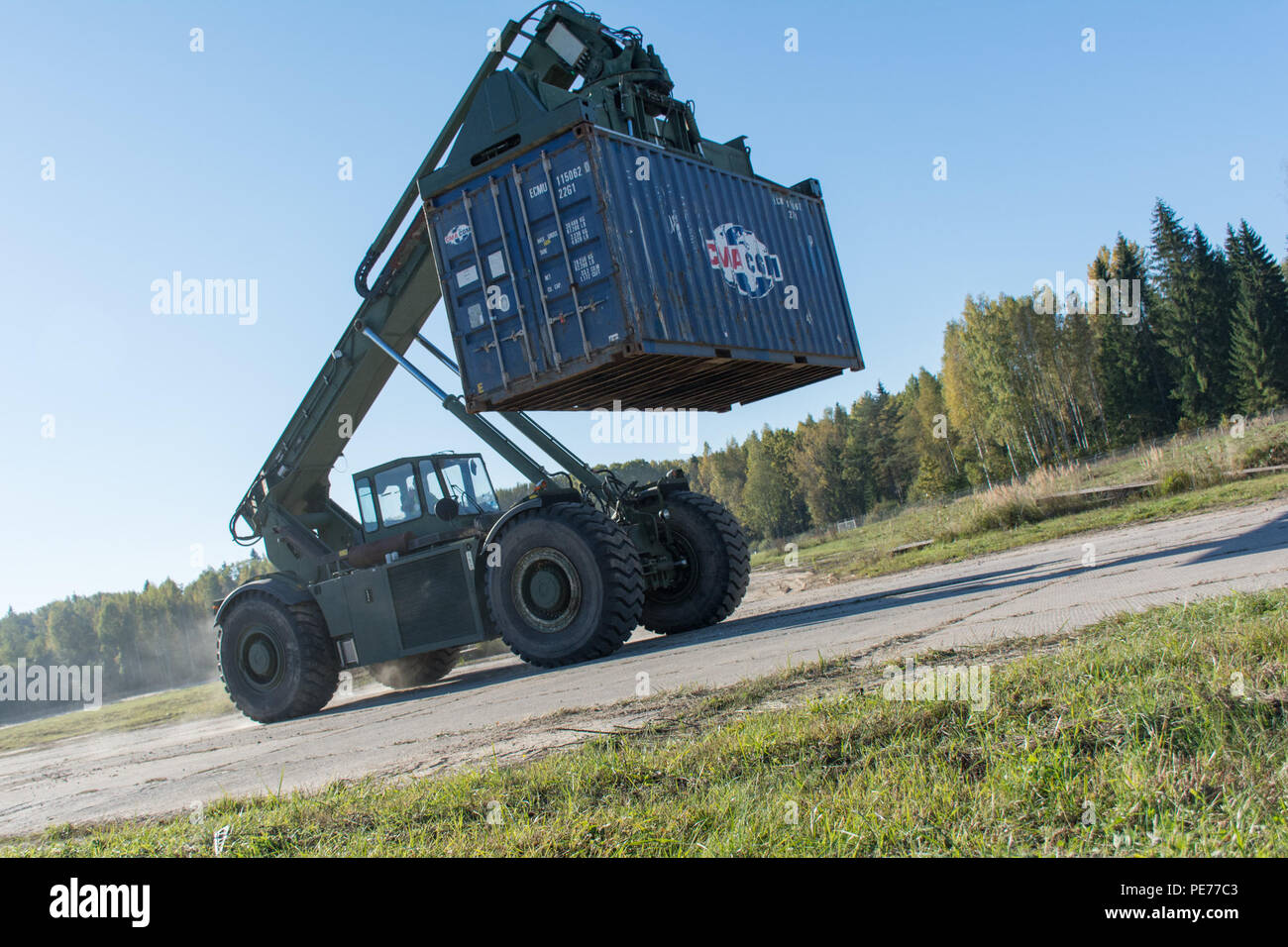 NATO Allied Rapid Reaction Corps (ARRC) personnel move equipment in ...