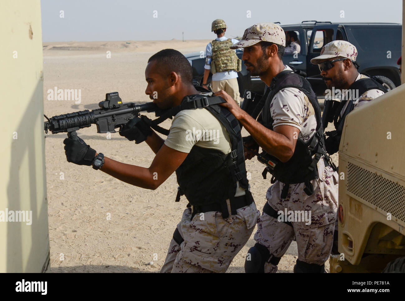 Members of Kuwait’s Amiri Guard prepare to assault a building during an ...