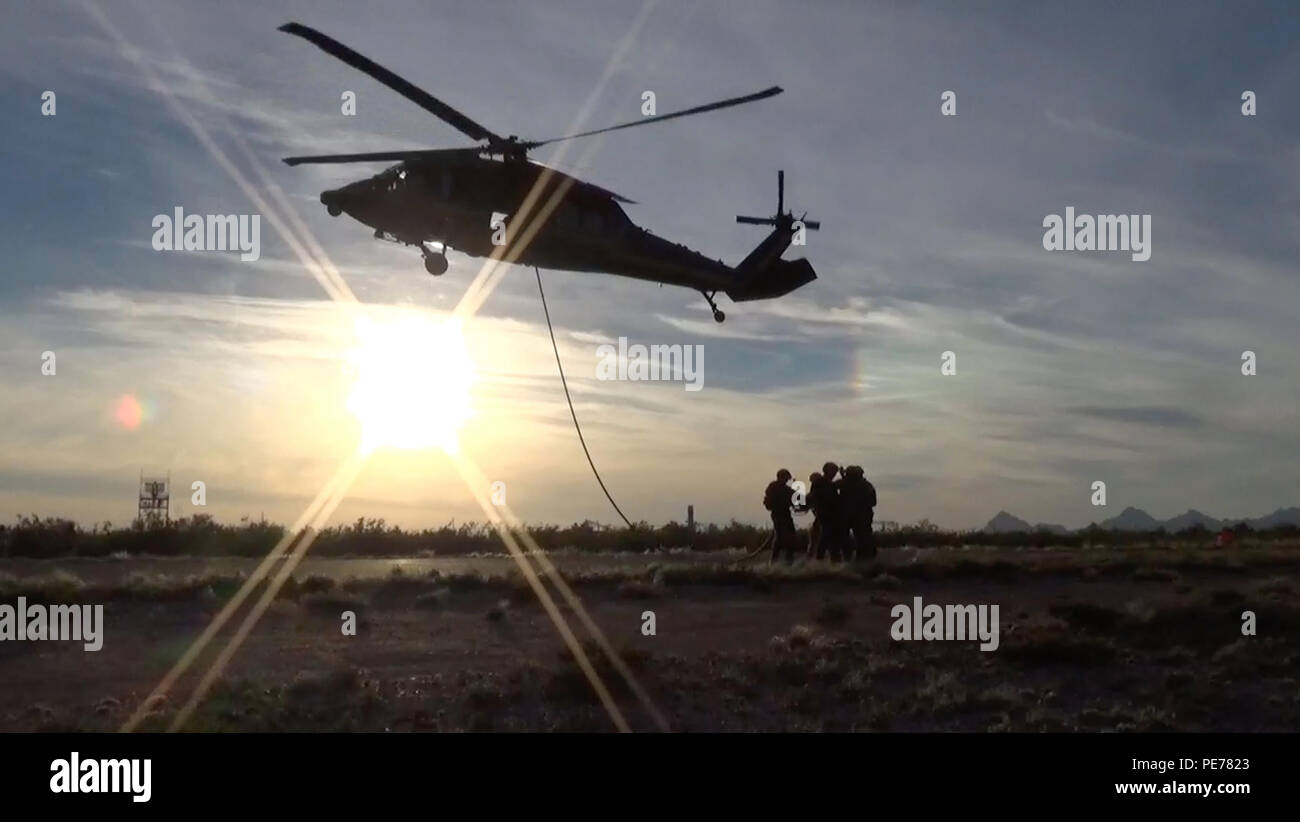An Air and Marine Operations Black Hawk flies overhead carrying Tucson ...