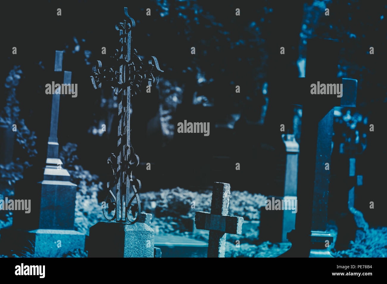 Old Graveyard at night. Moody blue toned. The concept of Halloween and ...