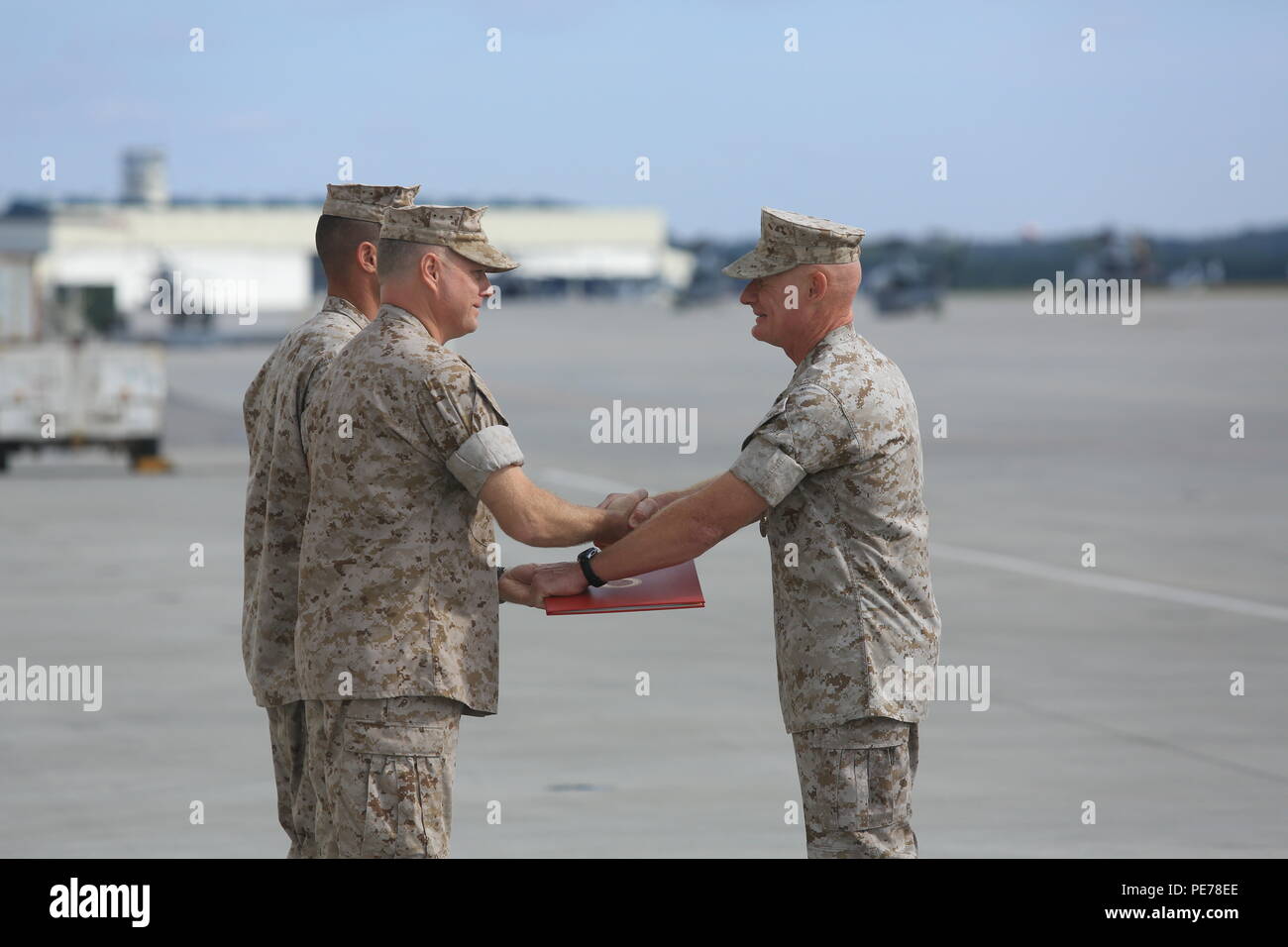 U.S. Marine Corps Lt. Col. Michael J. Harmon, left, the commanding ...