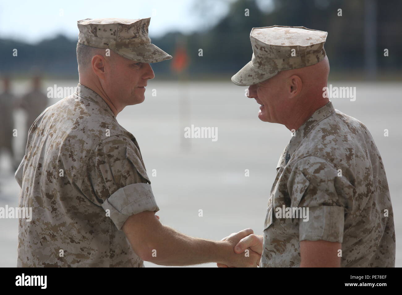 U.S. Marine Corps Lt. Col. Michael J. Harmon, left, the commanding ...