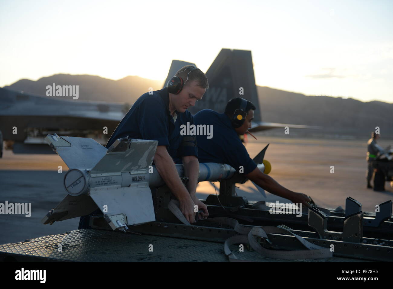 Staff Sgt. Won Yi (right) and Airman 1st Class Michael Chartrand, both ...