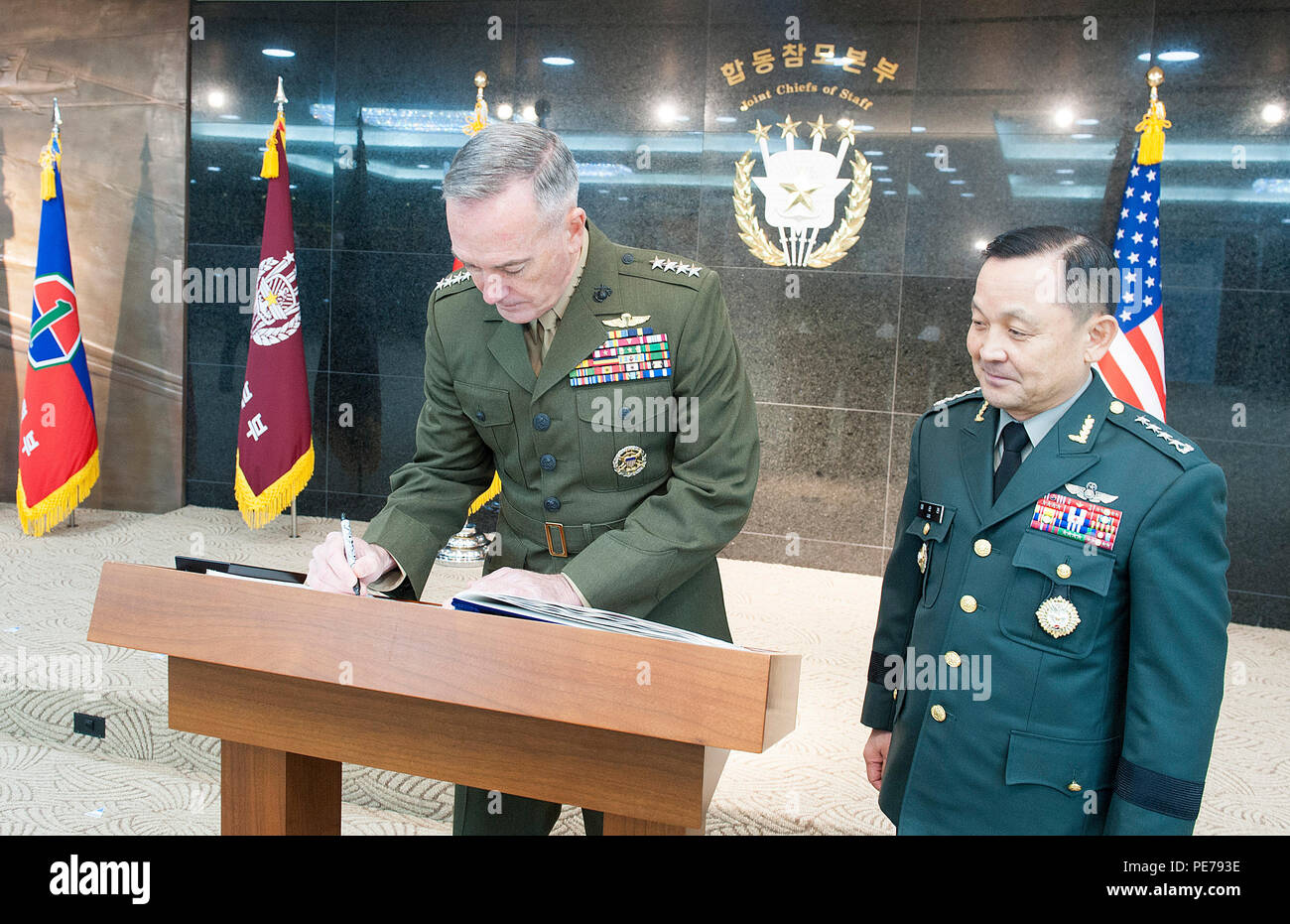 Marine Corps Gen. Joseph F. Dunford Jr., 19th Chairman of the Joint Chiefs of Staff, signs the ...