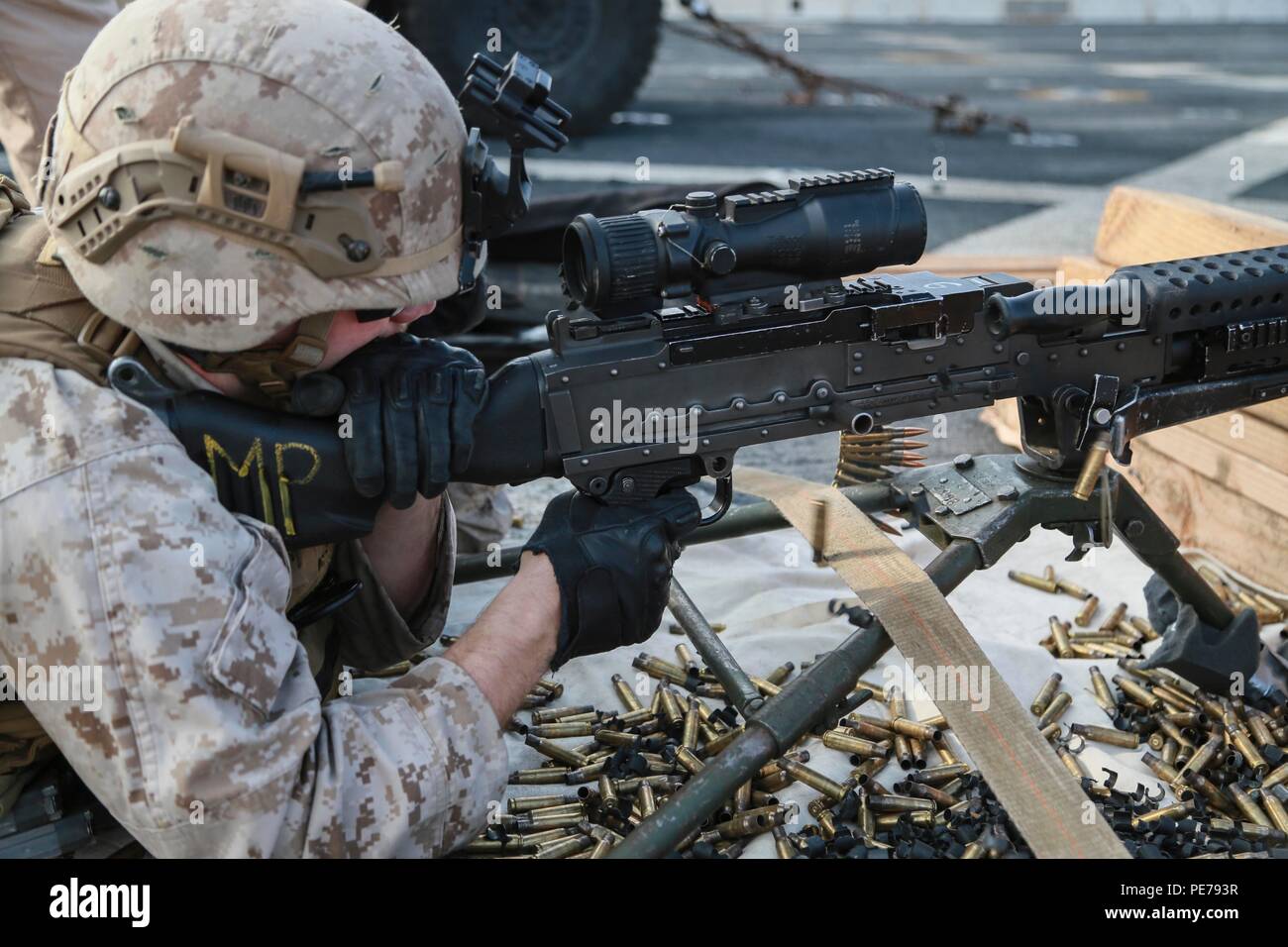 GULF OF ADEN (Oct. 29, 2015) U.S. Marine Cpl. Timothy Costello fires an ...