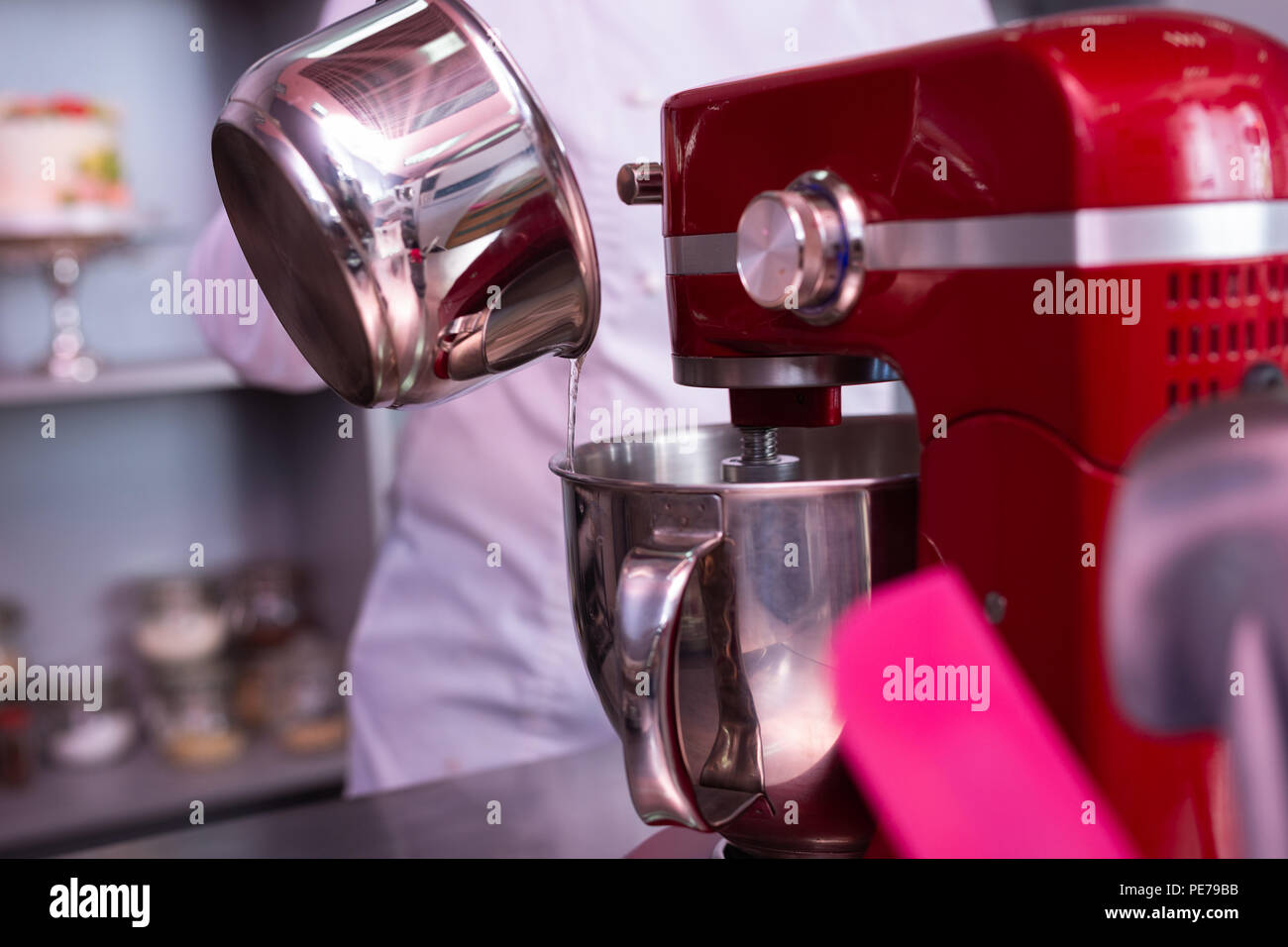 Professional famous chef using modern red cooking machine Stock Photo ...