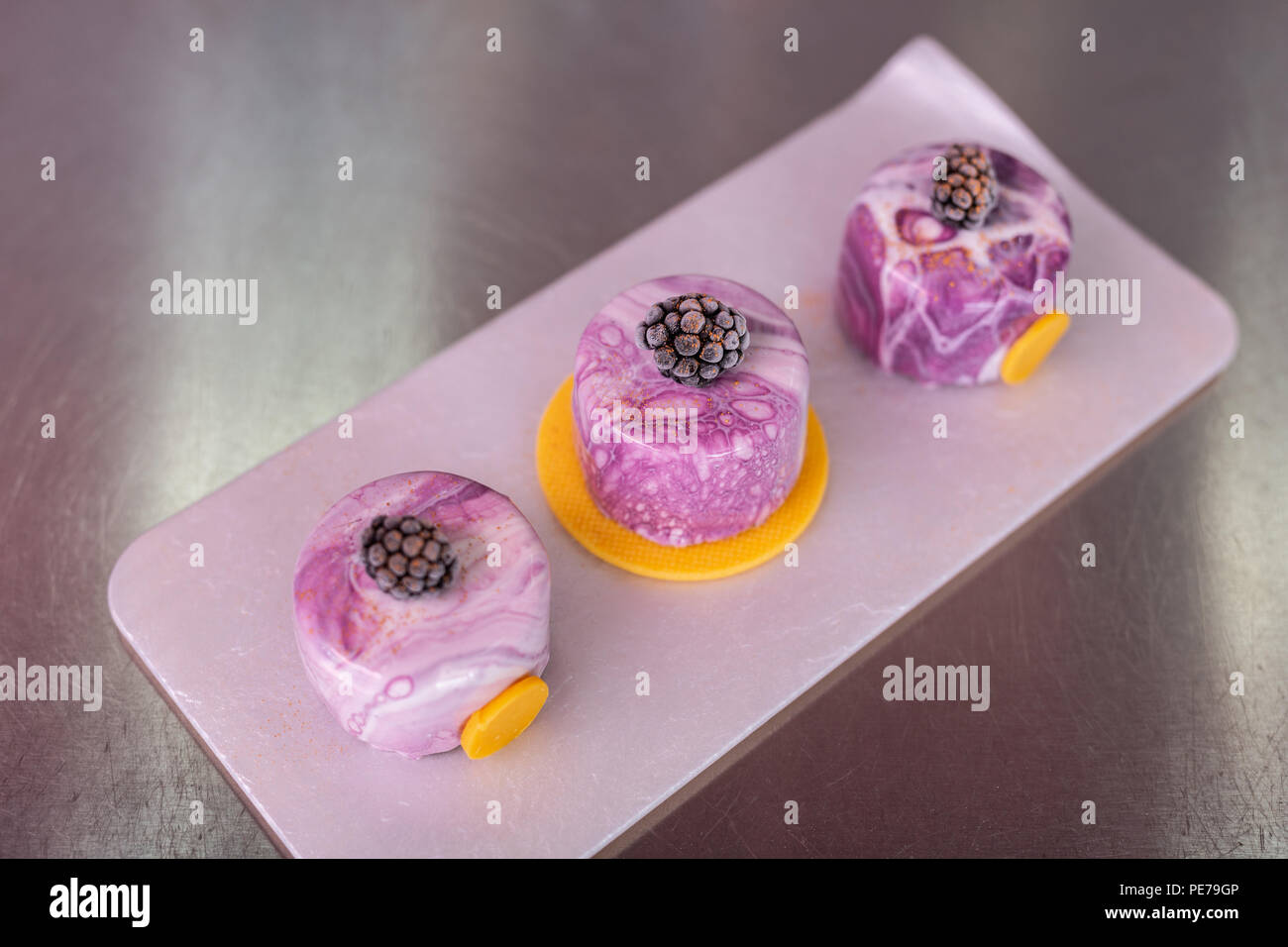 Top view of perfect blueberry cakes with mirror icing Stock Photo - Alamy