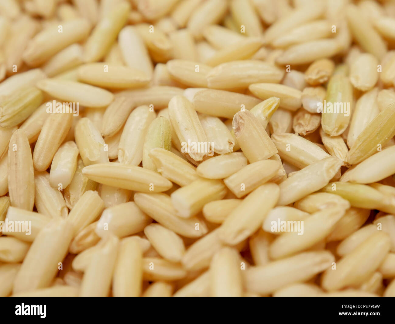 Raw brown rice. top view food background texture Stock Photo - Alamy