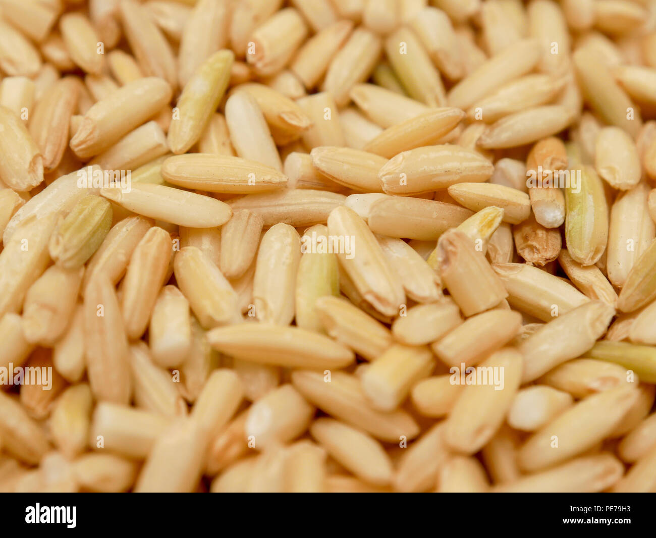 Raw brown rice. top view food background texture Stock Photo - Alamy