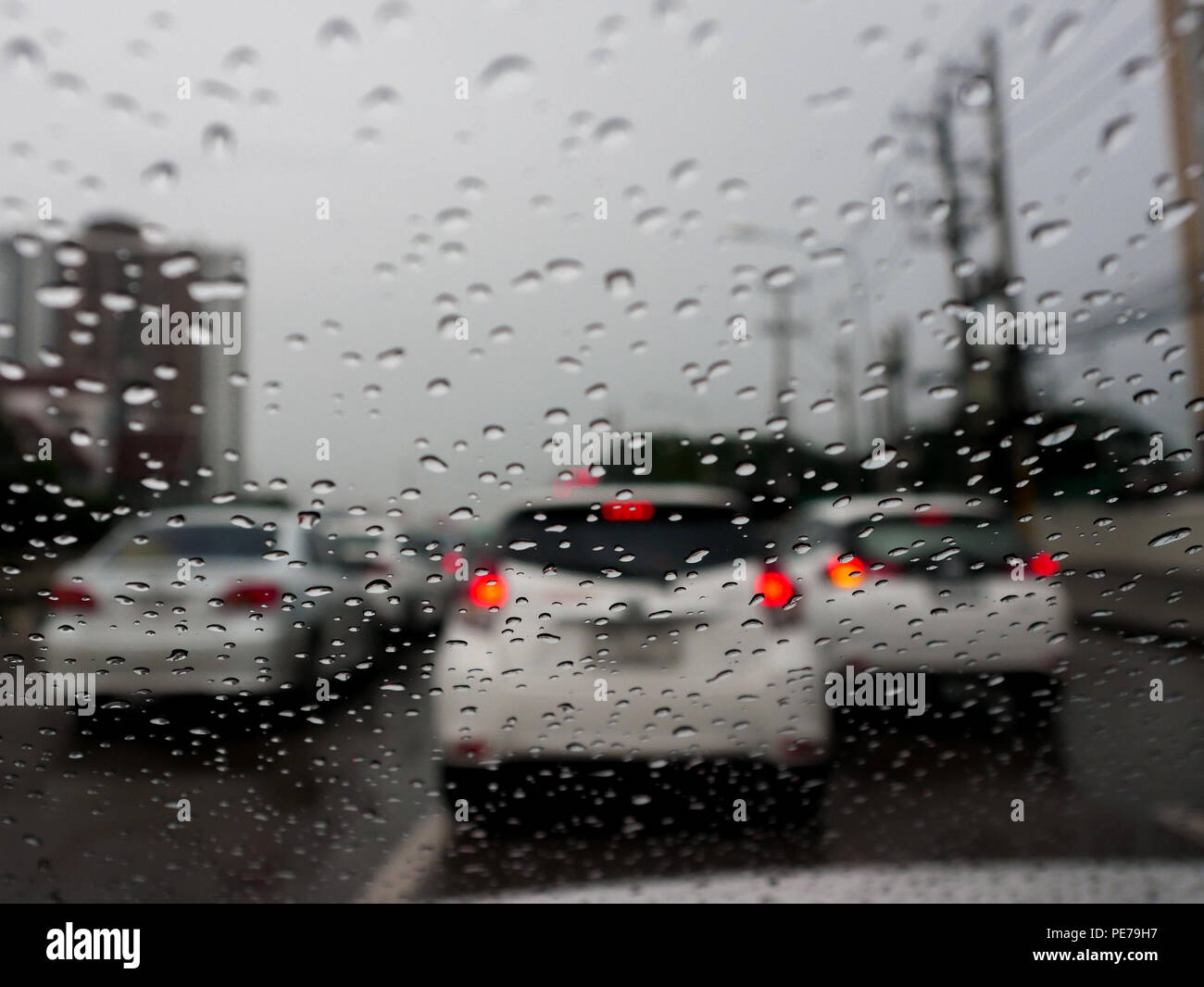 Traffic jam in rainy day with raindrops on car glasses Stock Photo - Alamy