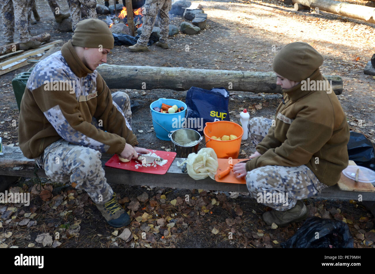 Latvian cadets show civilian university students from Riga how food is ...