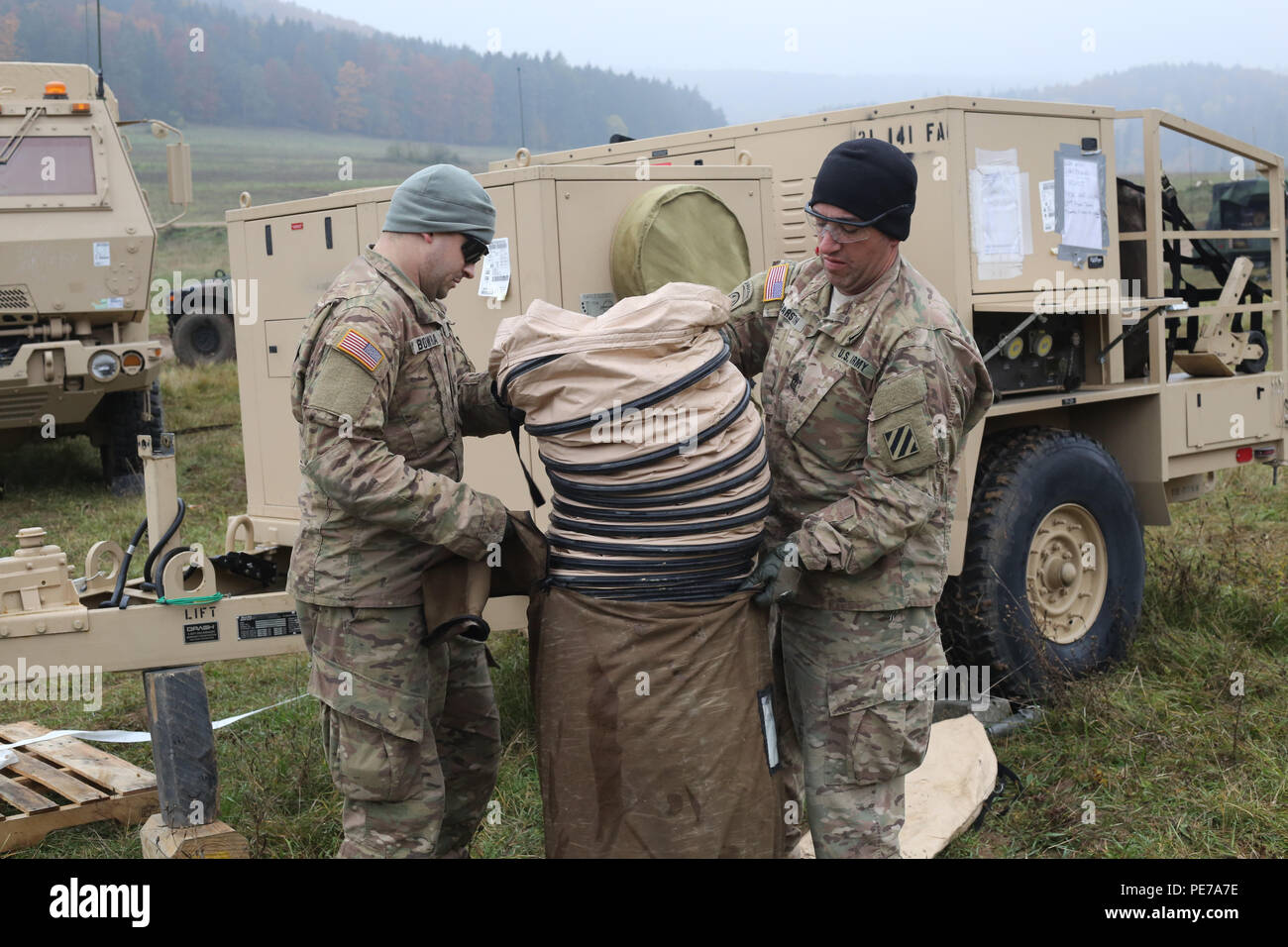 U.S. Army 1st Lt. Michael Bowra, left, and 1st Sgt. Brian Barstow, both ...