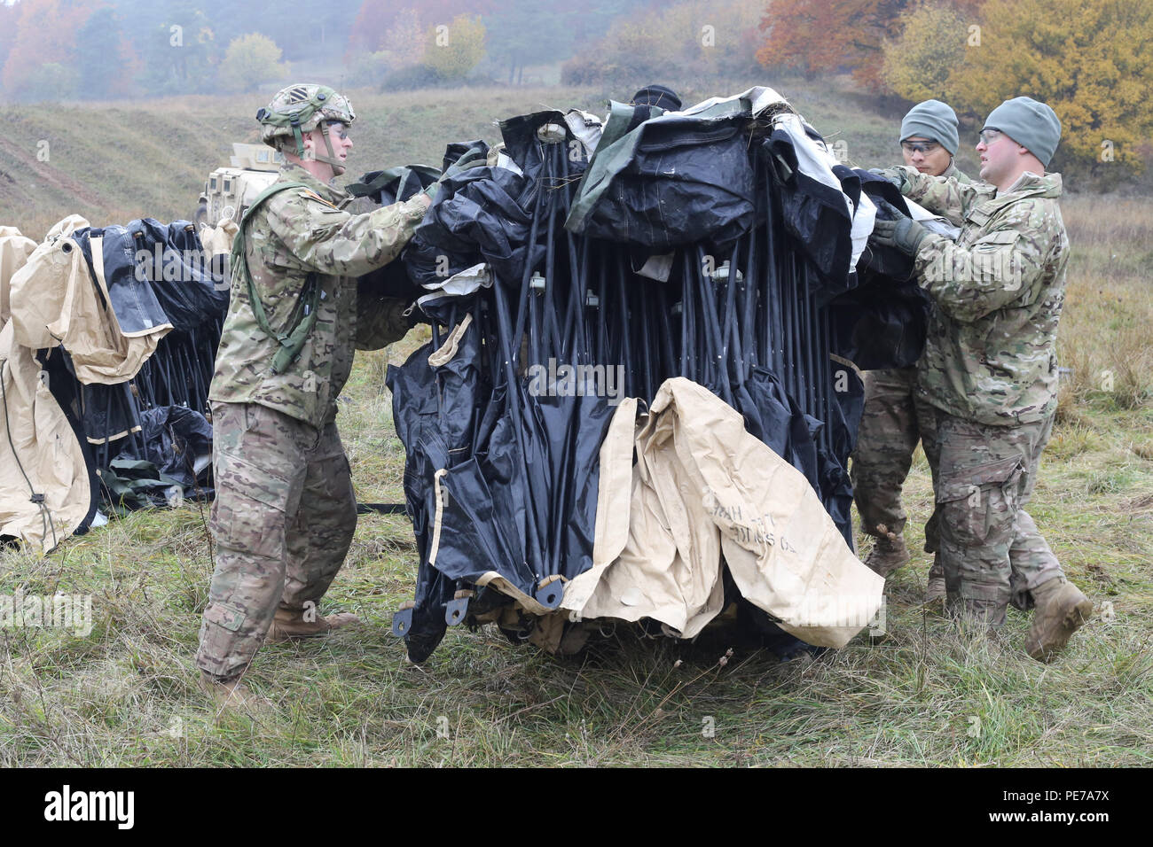U.S. Army Capt. Timothy Moore, left, commander of Headquarters Battery ...