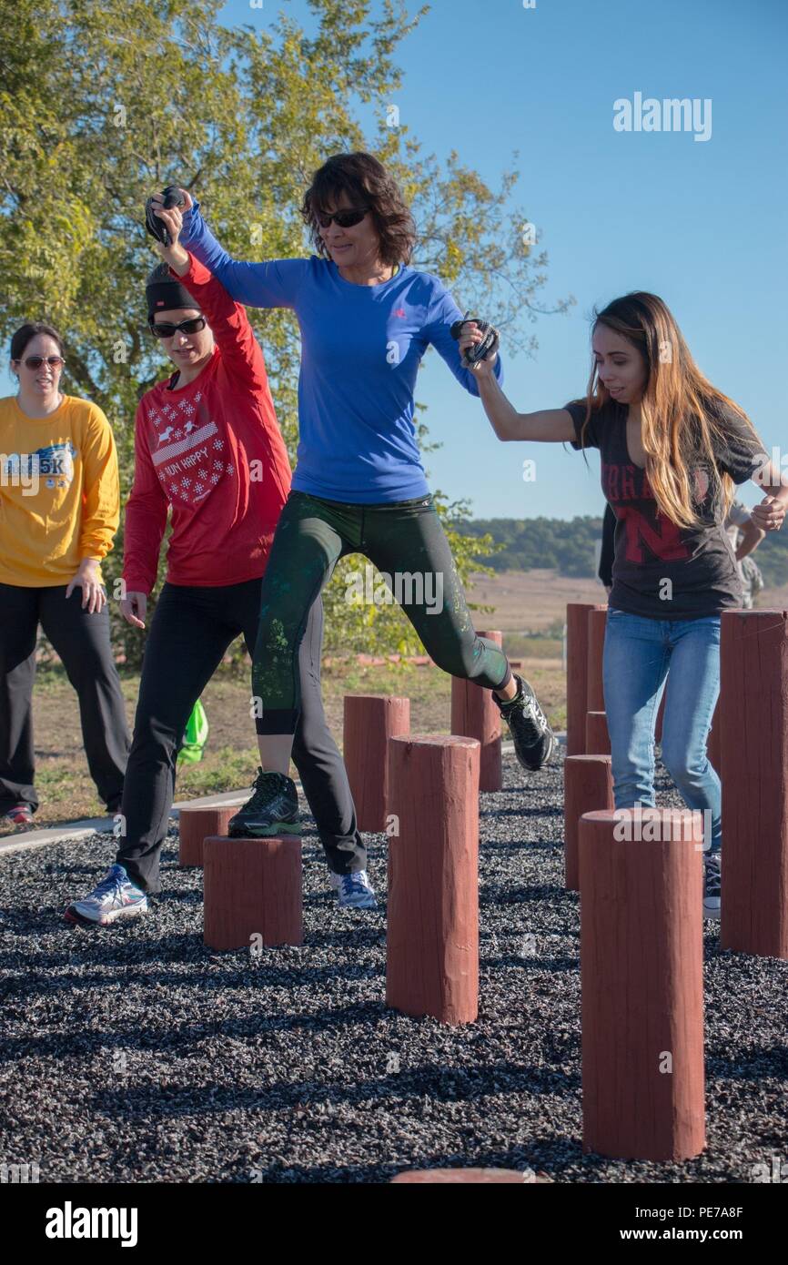 Members of team three help each other out during the island hopping ...