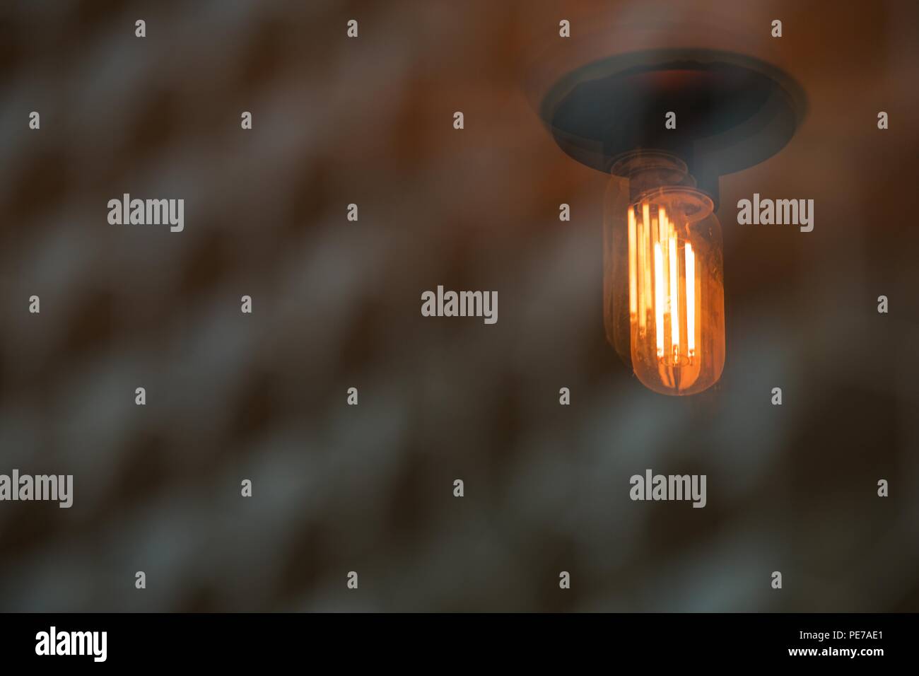 Vintage edison globe on geometric background Stock Photo - Alamy