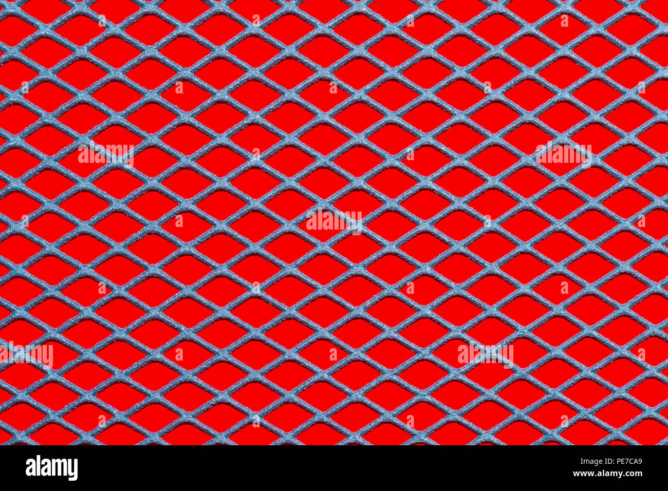 Metallic mesh grid on a red background Stock Photo - Alamy