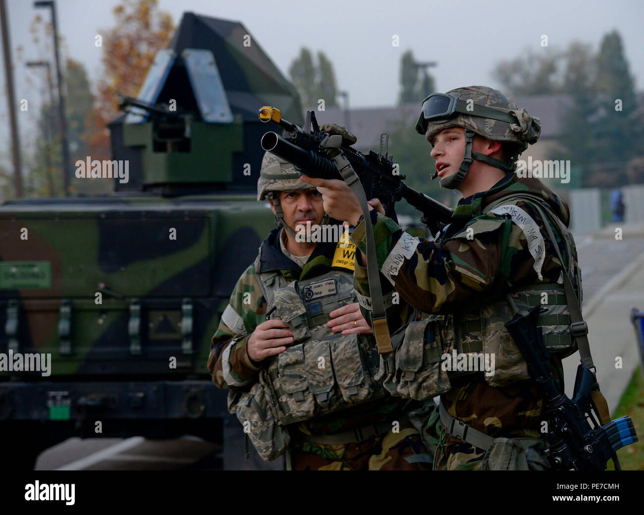 Airman Bradley Maier, 51st Security Forces Squadron, demonstrates using ...