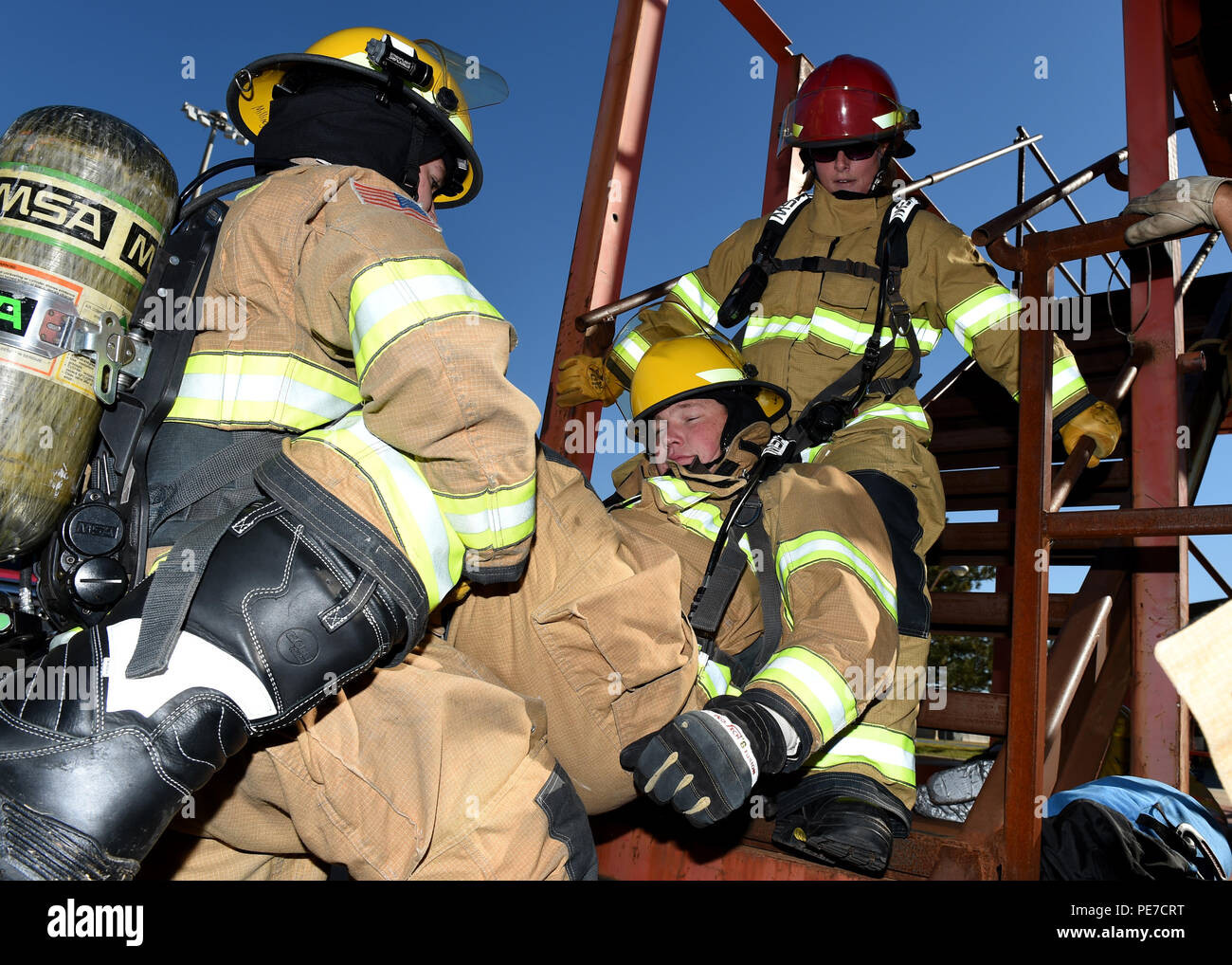 Firefighters from the 97th Civil Engineer Squadron practice carrying an ...