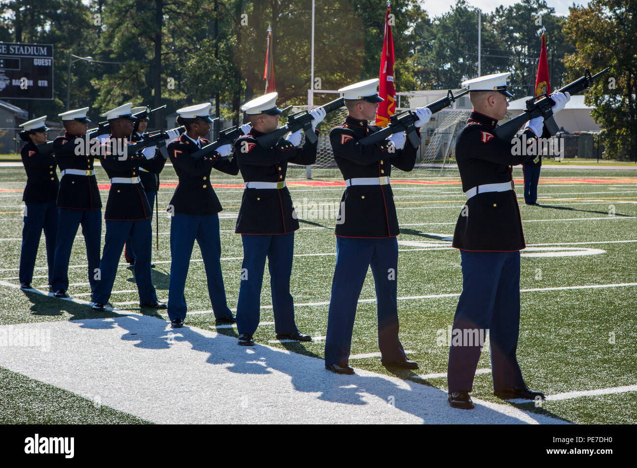 U.S. Marines with the rifle detail render a rifle salute during the ...