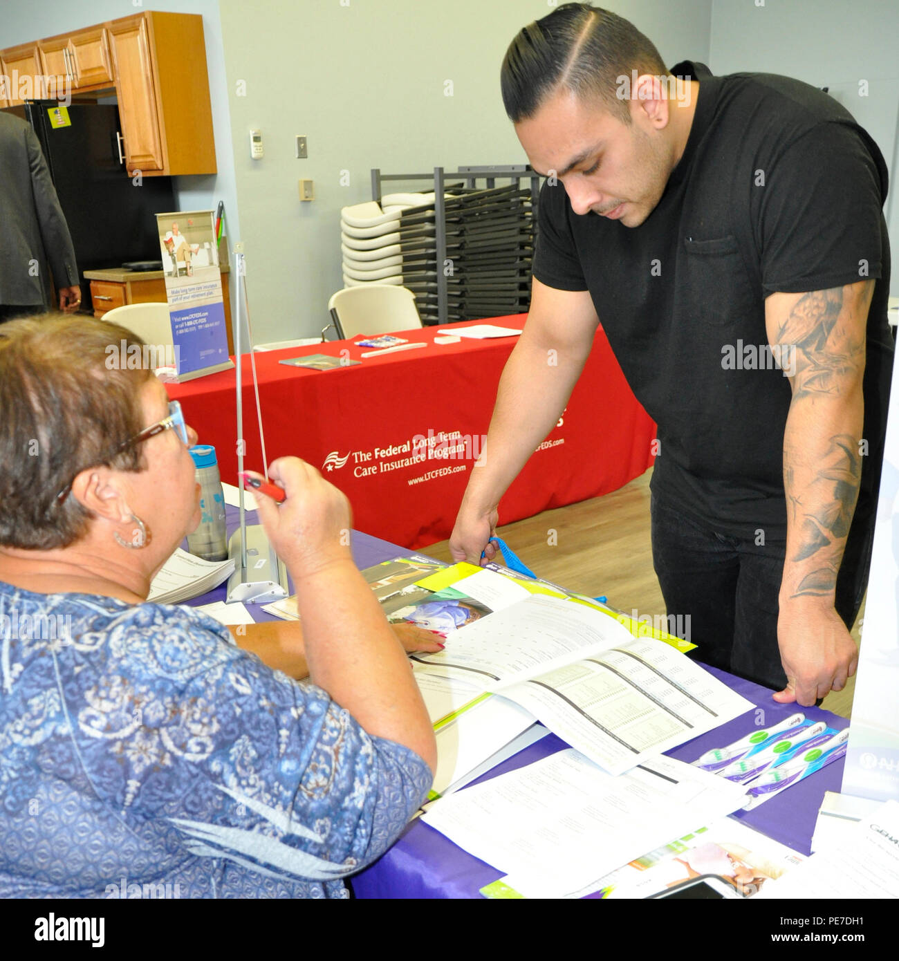 Adrian Castillo, meat cutter at the base commissary, inquires about ...