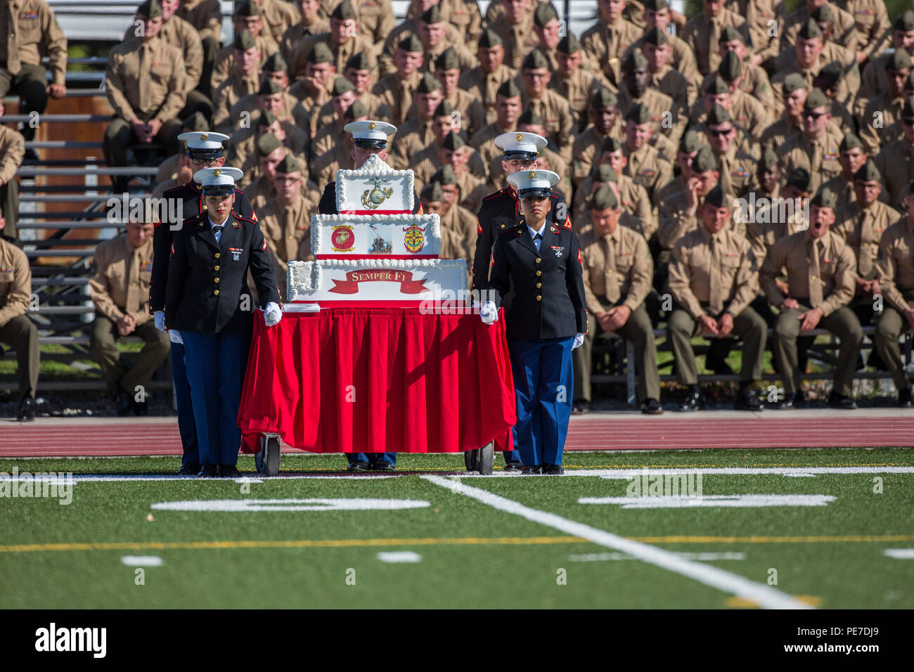 U.S. Marines march on the ceremonial cake during the Joint Daytime ...