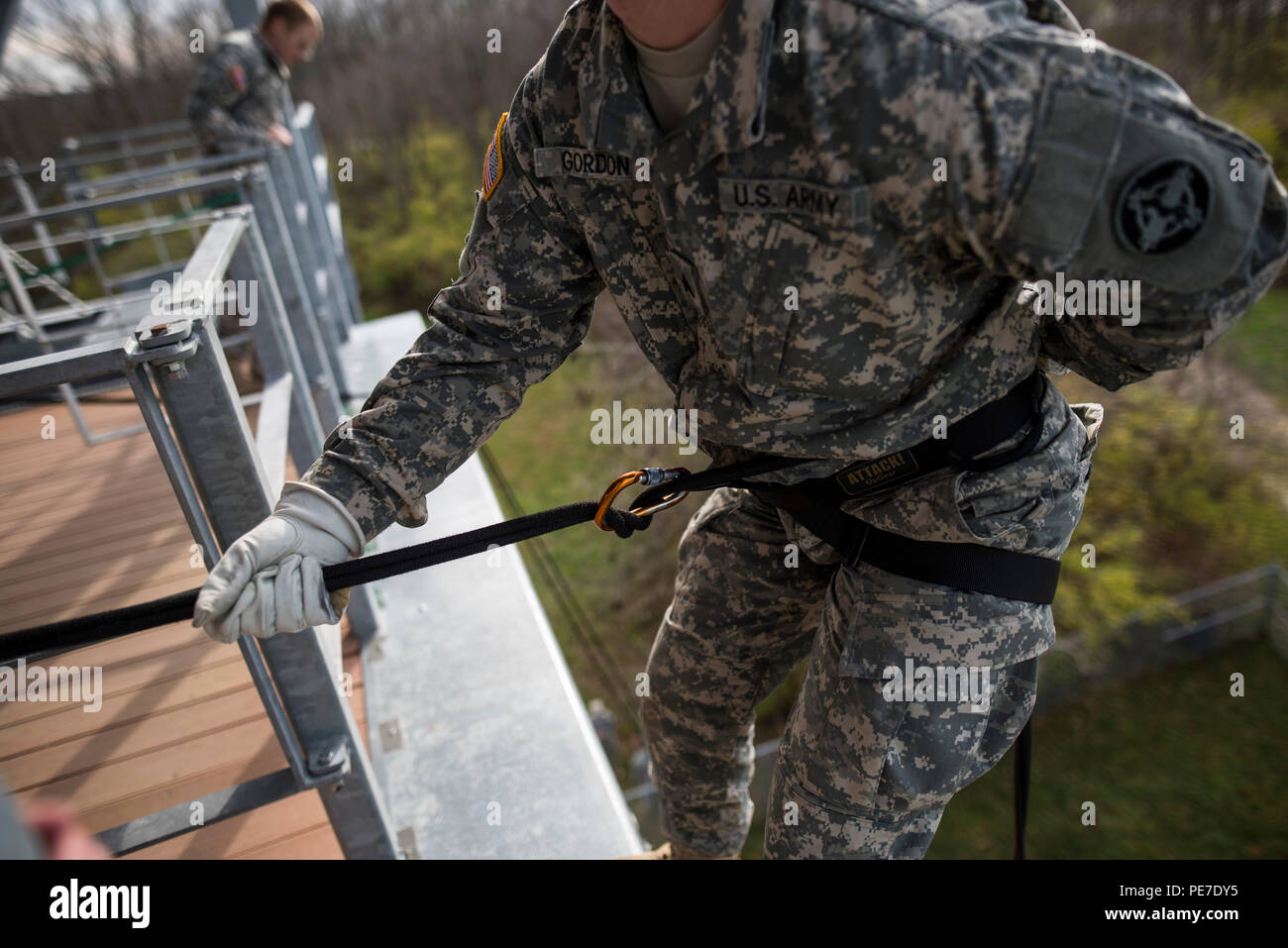 A U.S. Army Reserve military police Soldier prepares to rappel down a ...