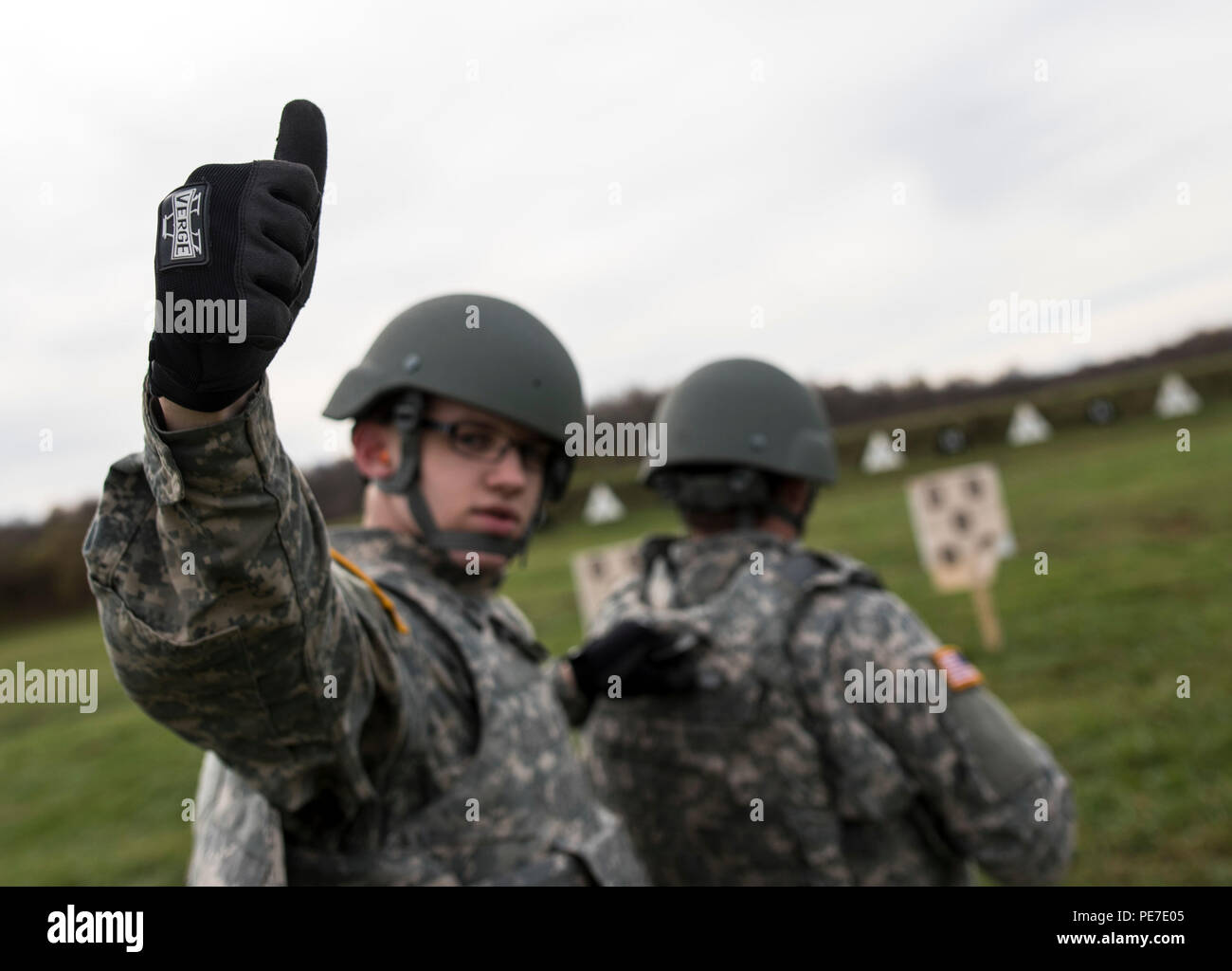 A U.S. Army Reserve military police Soldier gives a thumbs-up while ...