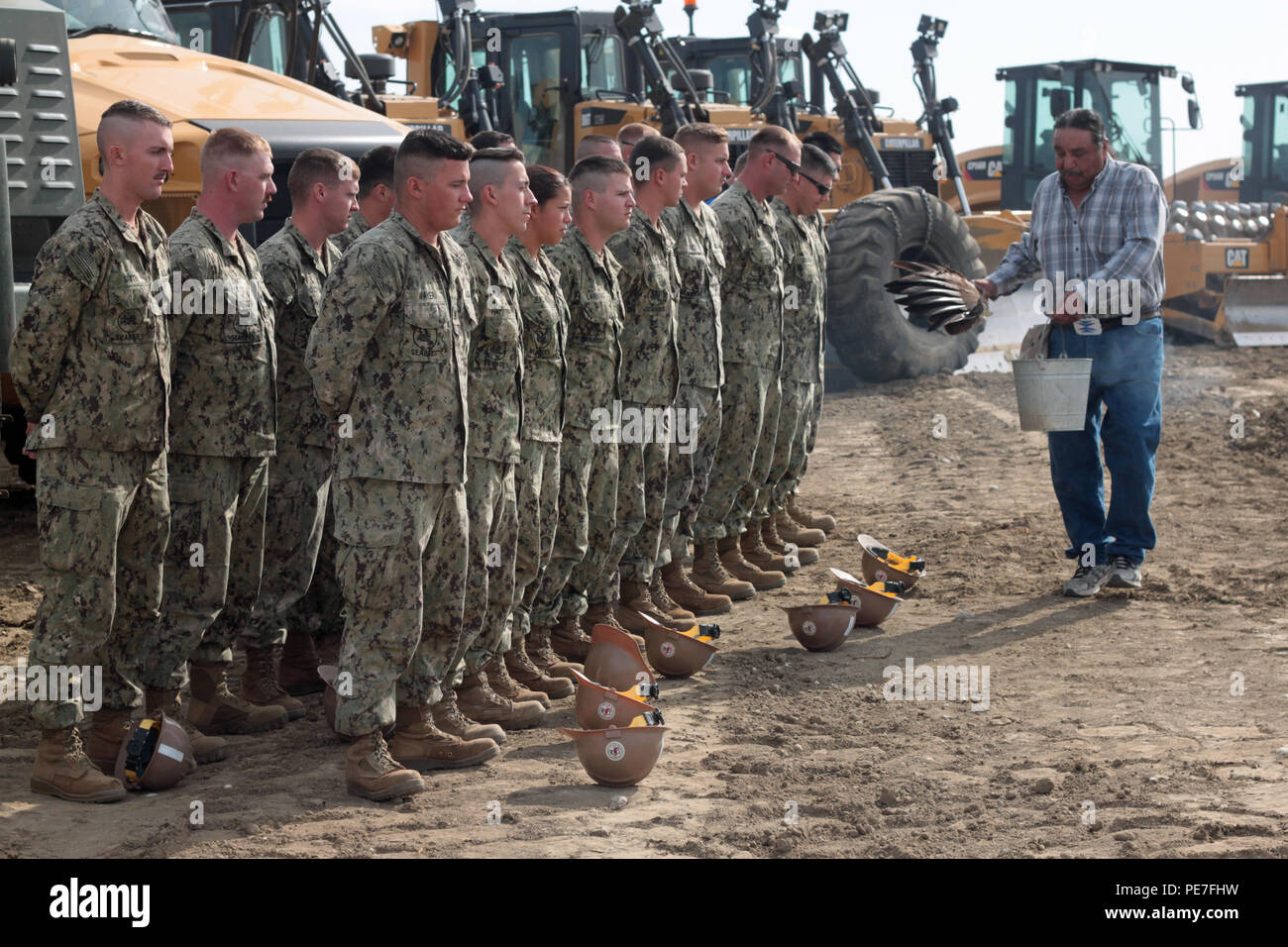 Seabees assigned to Naval Mobile Construction Battalion 133 stand in ...