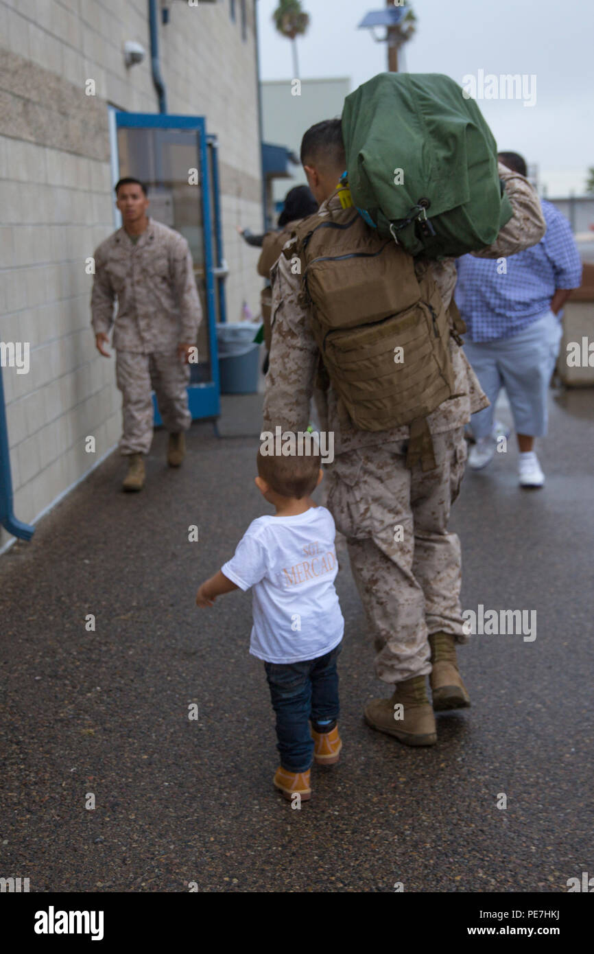 A Marine with Marine Fighter Attack Squadron (VMFA) 232 walks his son ...