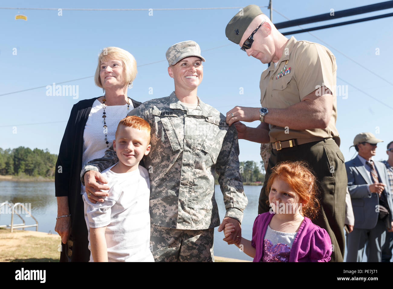 U.S. Marine Corps Reserve Lt. Col. Allan Jaster, right, pins the Ranger ...