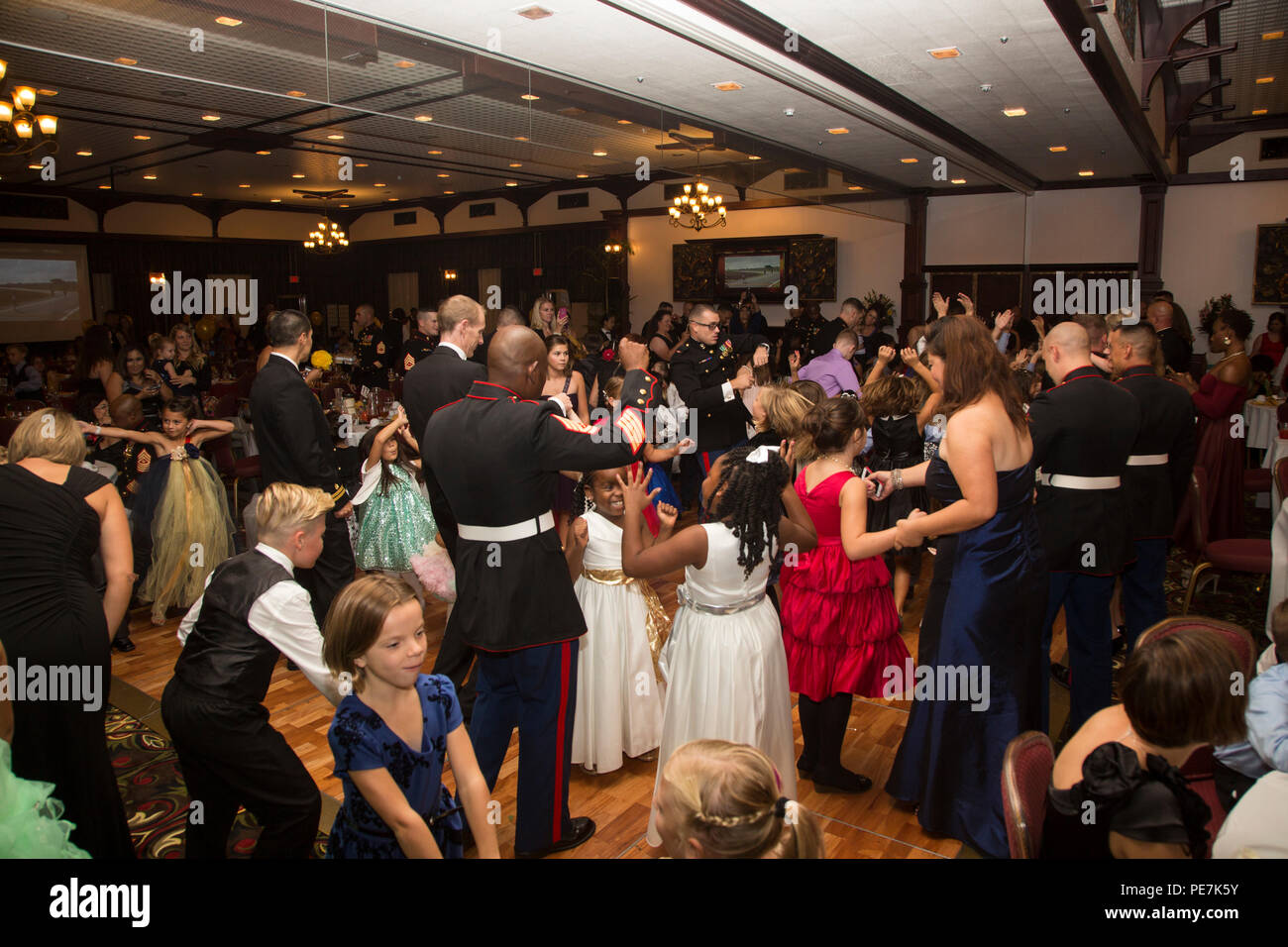 U.S. Marines and sailors, with 3D Marine Division, dance with their ...