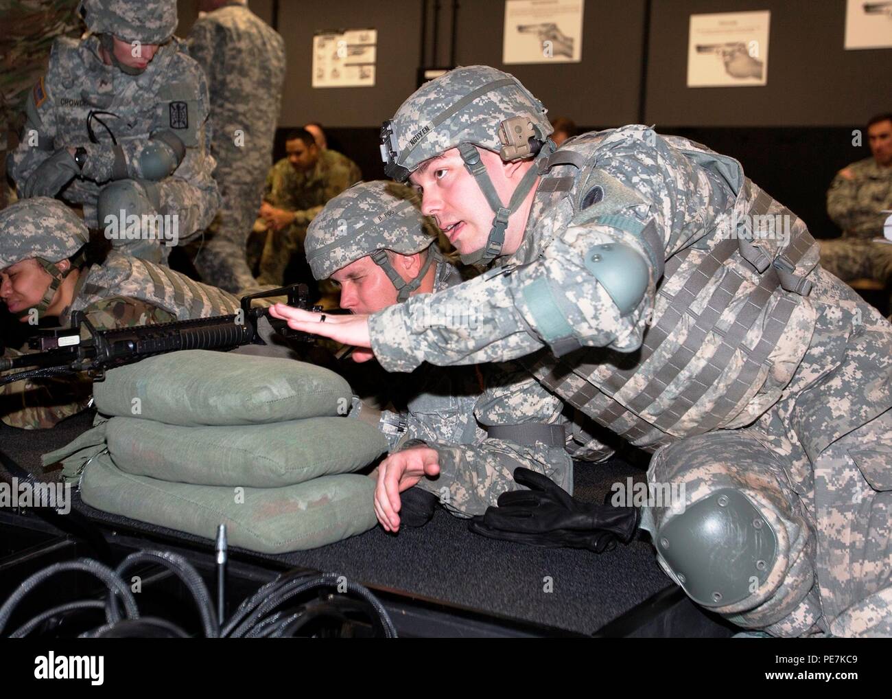 An instructor provides a helpful tip for his trainee Soldier to improve ...