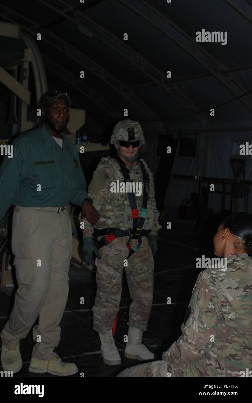 The class instructor, Muhammad Langley, demonstrates the safety belt ...