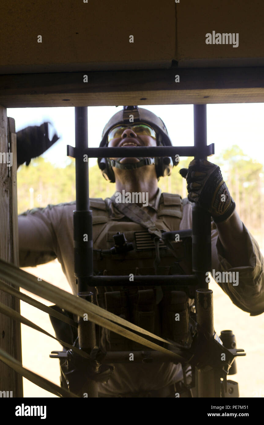 A soldier assigned to the 7th Special Forces Group (Airborne) climbs a ...